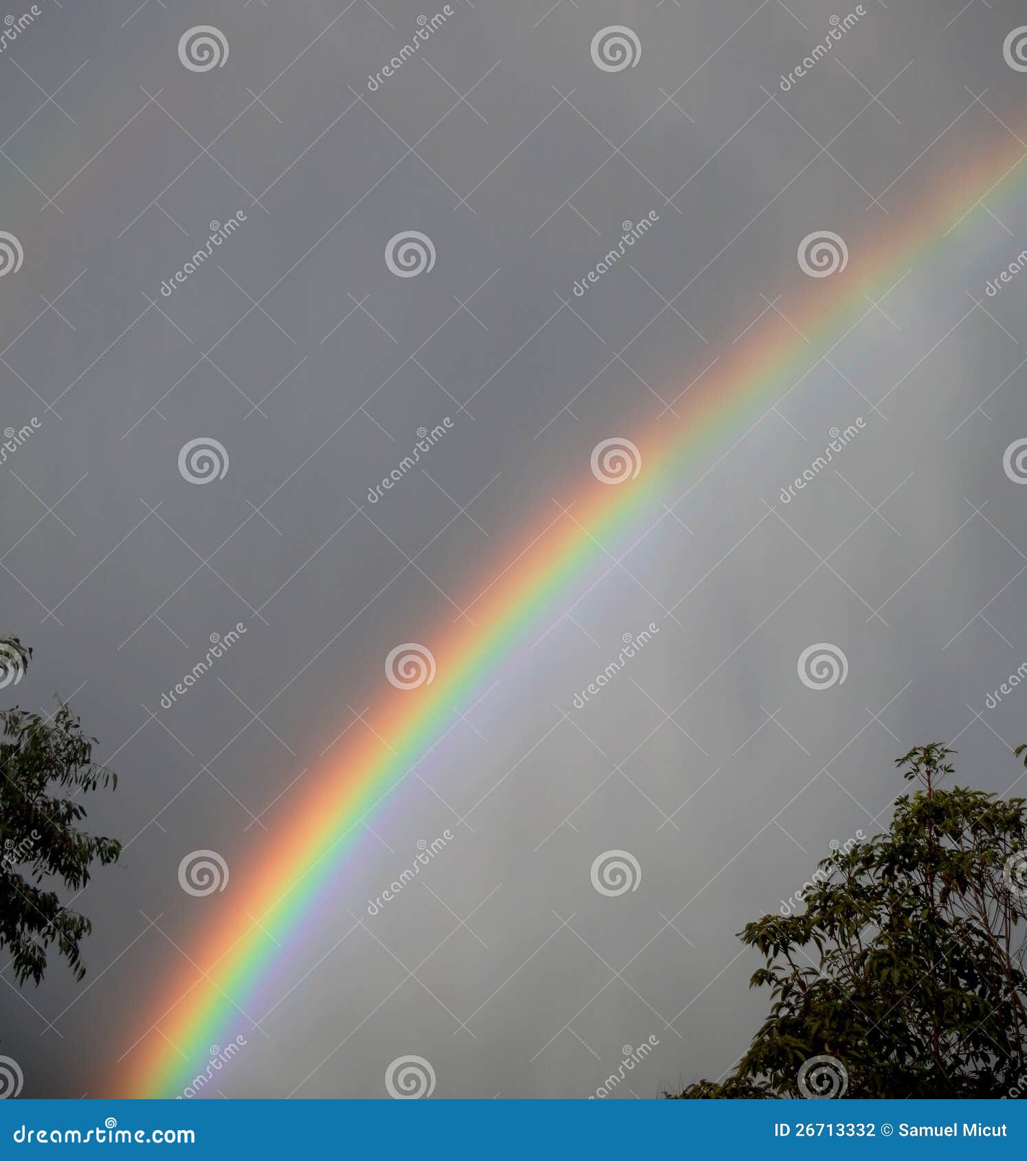 Rainbow on grey clouds stock photo. Image of beautiful - 26713332