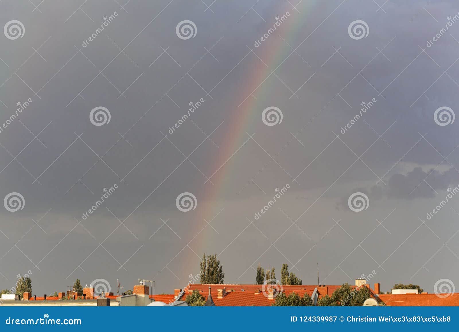 Rainbow with a grey sky stock image. Image of light - 124339987
