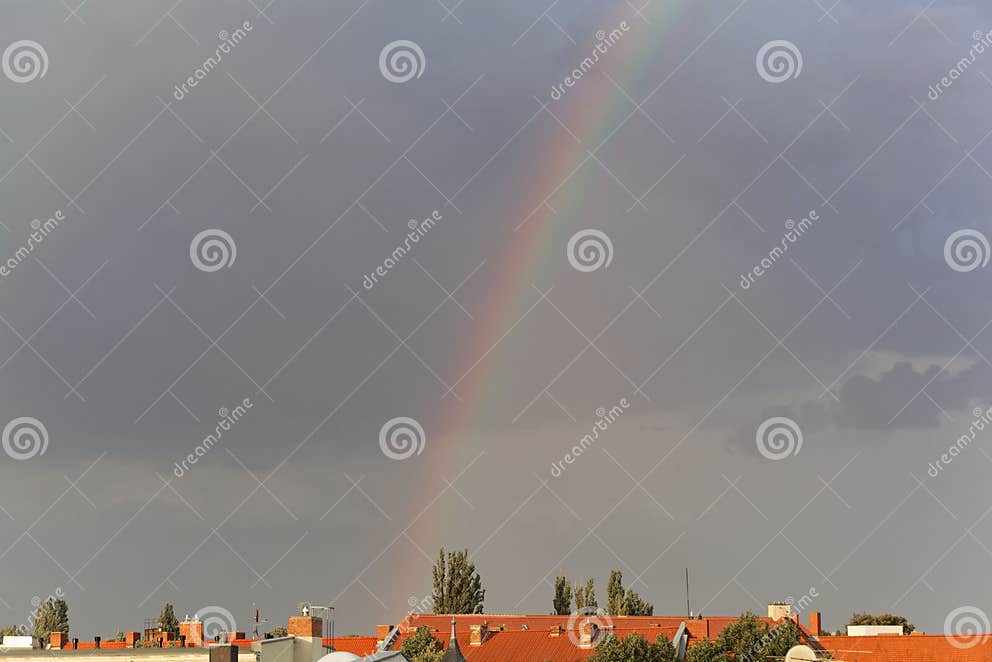 Rainbow with a grey sky stock image. Image of light - 124339987