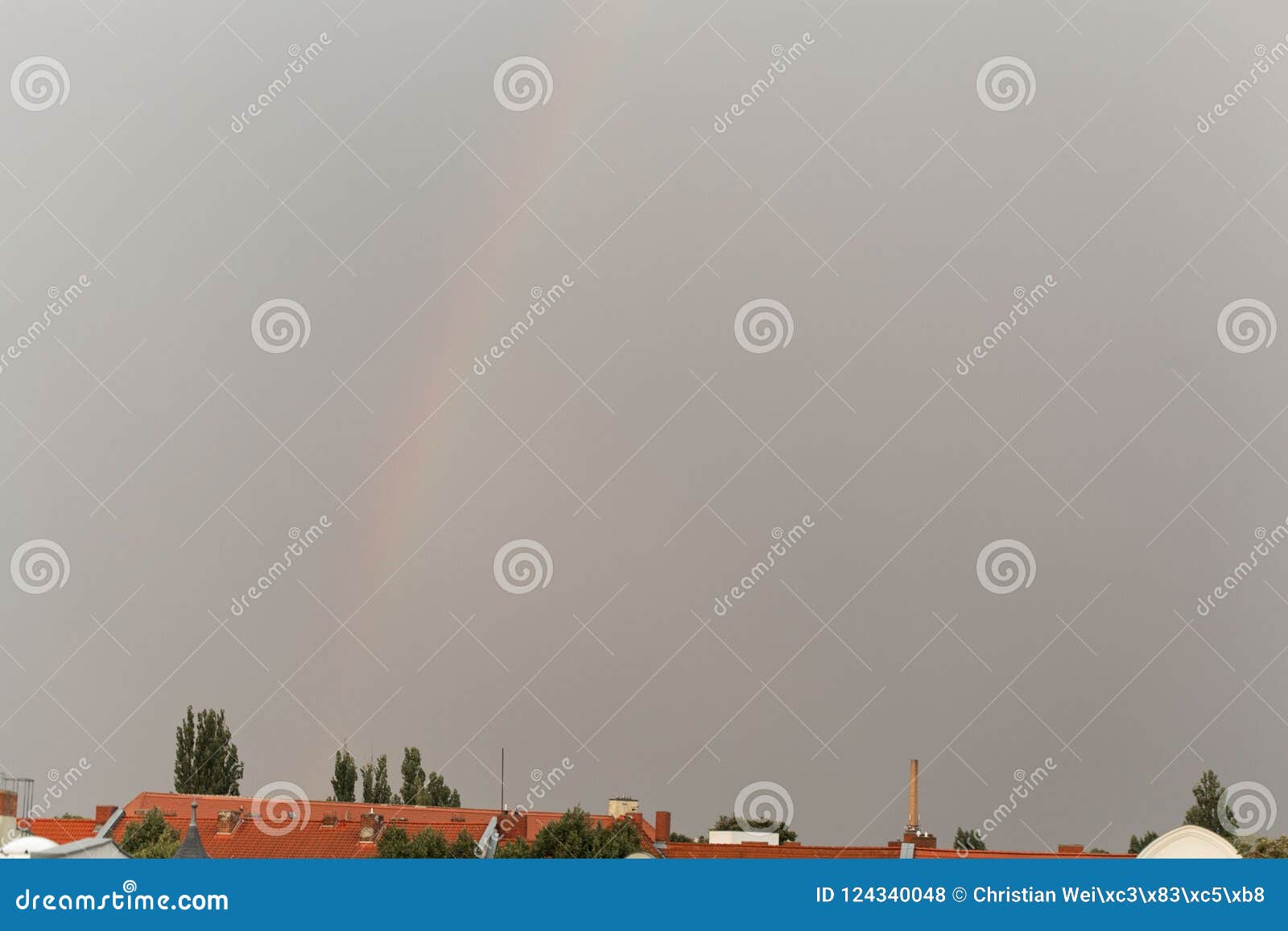 Rainbow with a grey sky stock photo. Image of atmosphere - 124340048