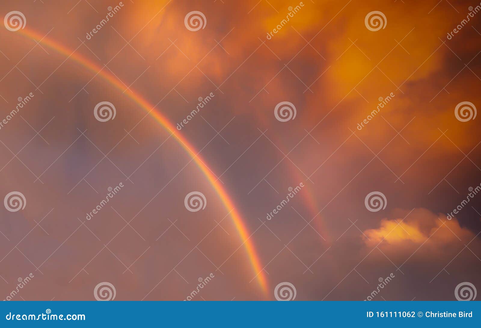 A Rainbow and a Hint of Its Double on a Stormy Evening at Sunset Stock ...