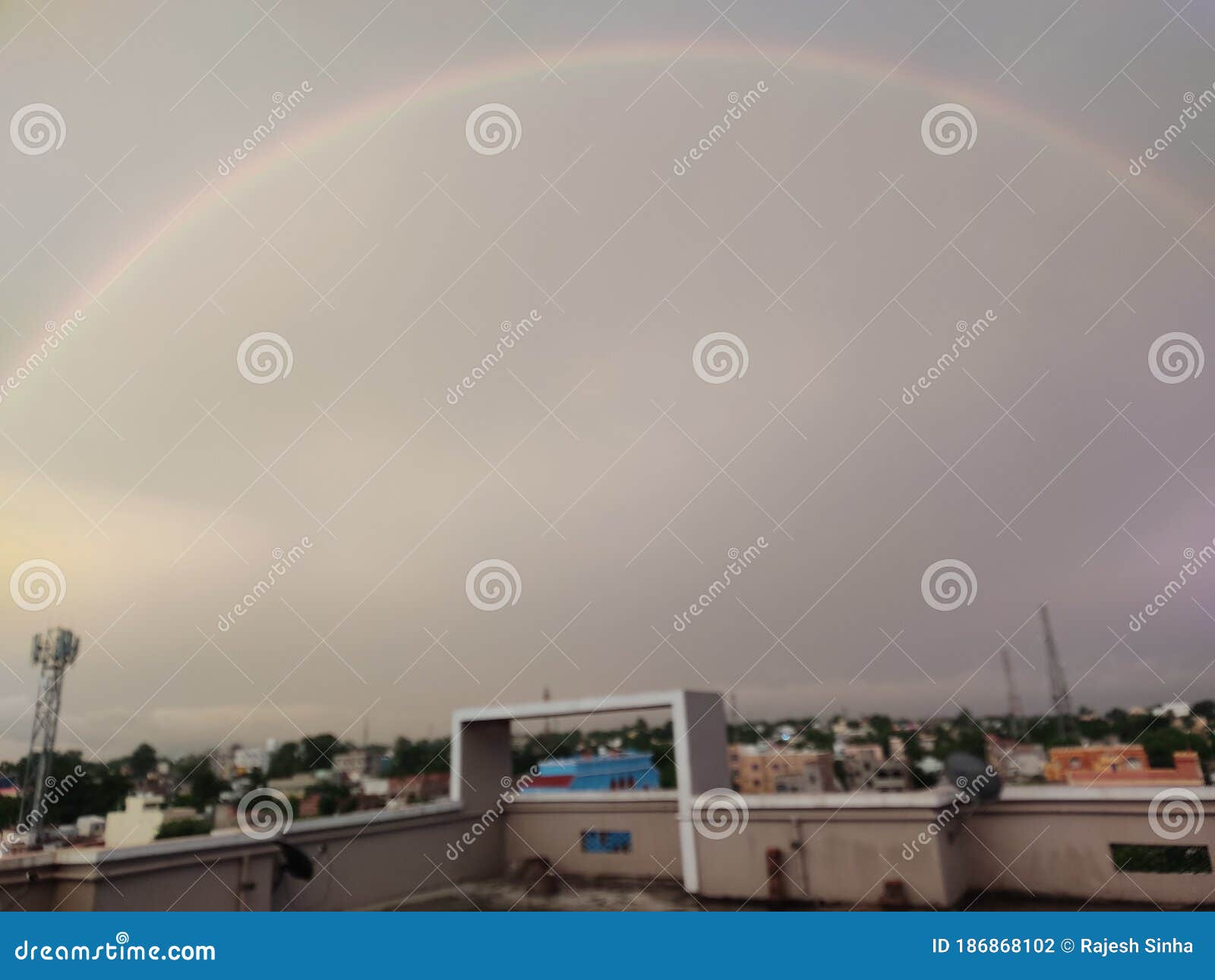 Rainbow after Mild Rain As Seen from Rooftop Stock Photo - Image of ...