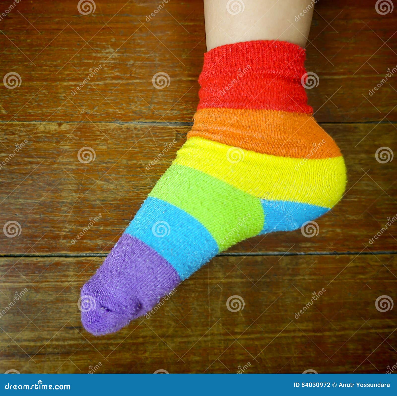Rainbow Multicolor Sock on Child Feed on Floor. Stock Photo - Image of ...
