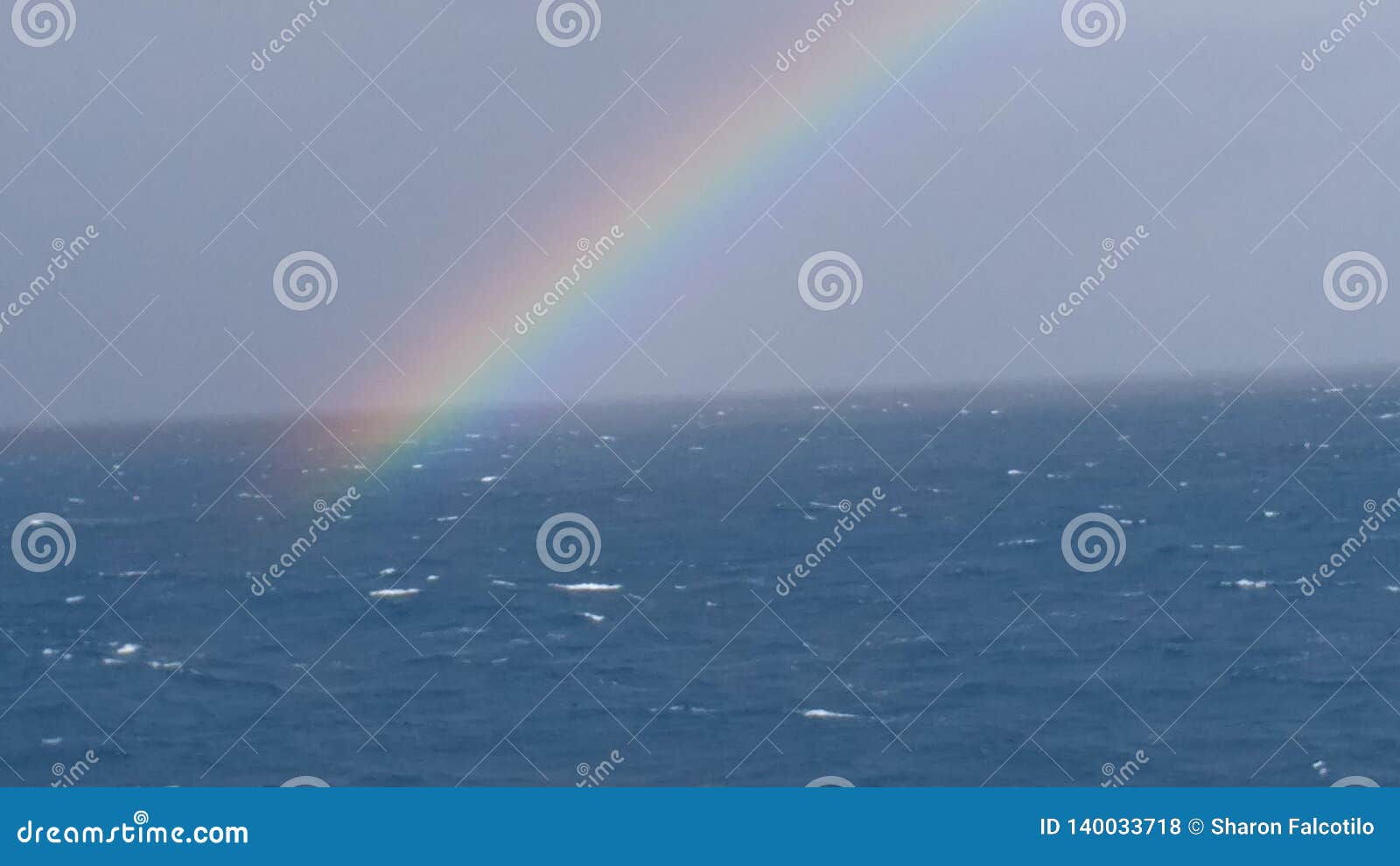 Rainbow on the ocean stock photo. Image of ocean, rainbow - 140033718