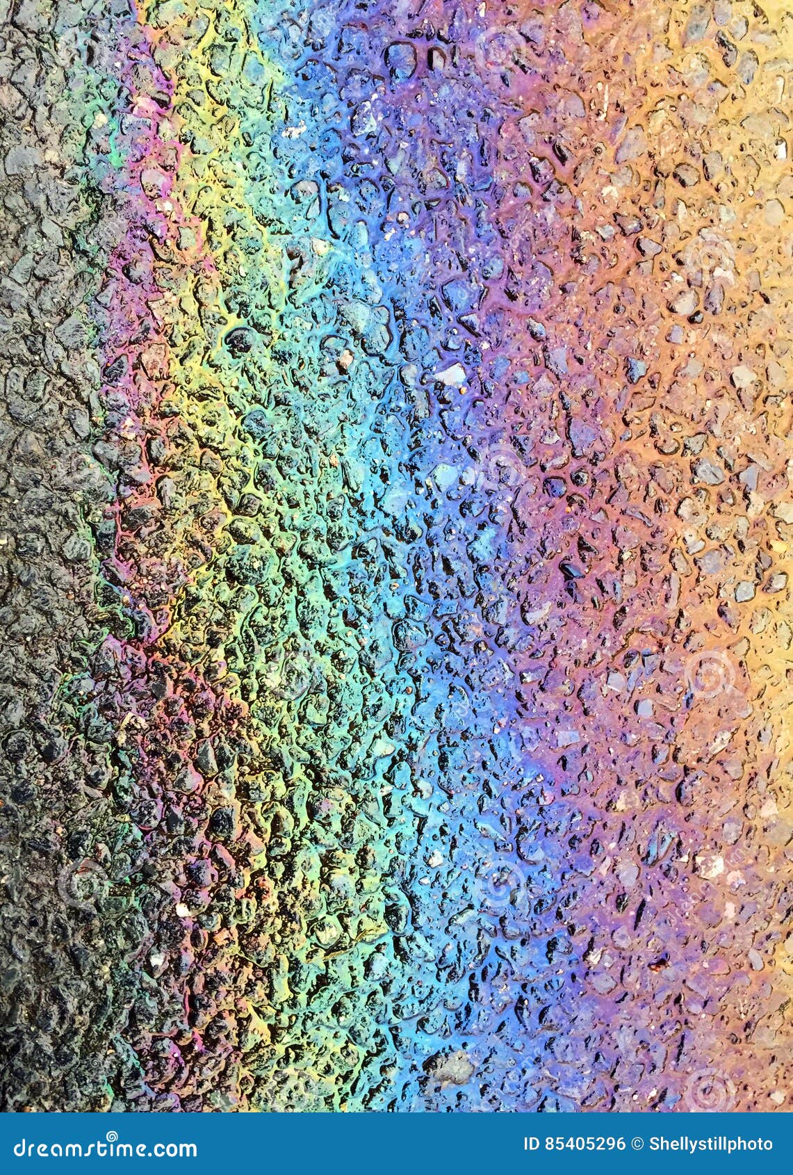Rainbow Oil Slick on a Road Stock Photo - Image of fluid, asphalt: 85405296