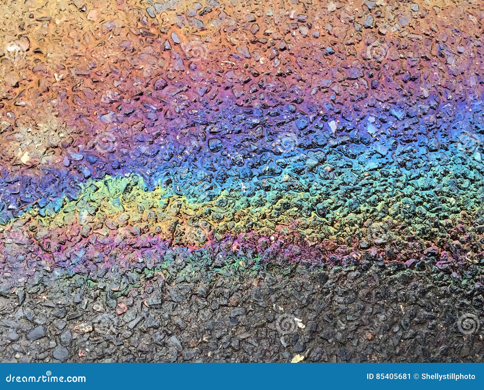 Rainbow Oil Slick on a Road Stock Image - Image of color, fluid: 85405681