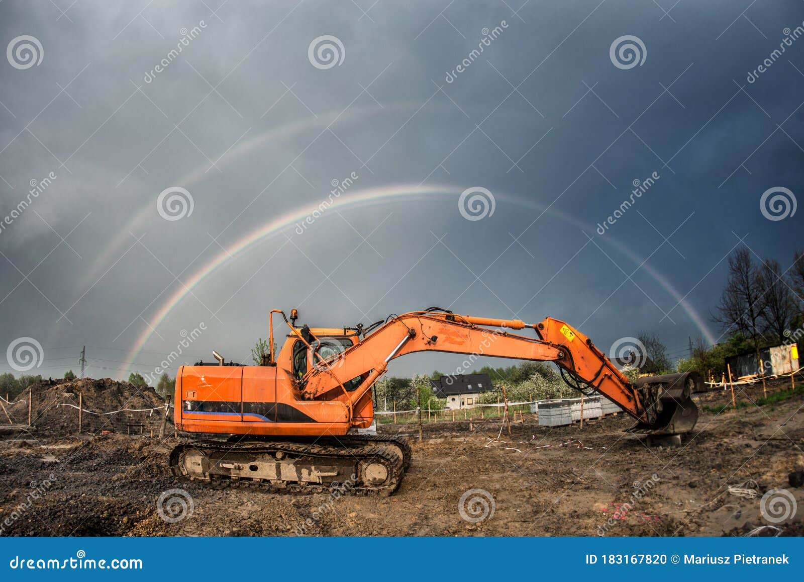 Rainbow on Orange Excavator Digger Stock Photo - Image of rainbow, dirt ...