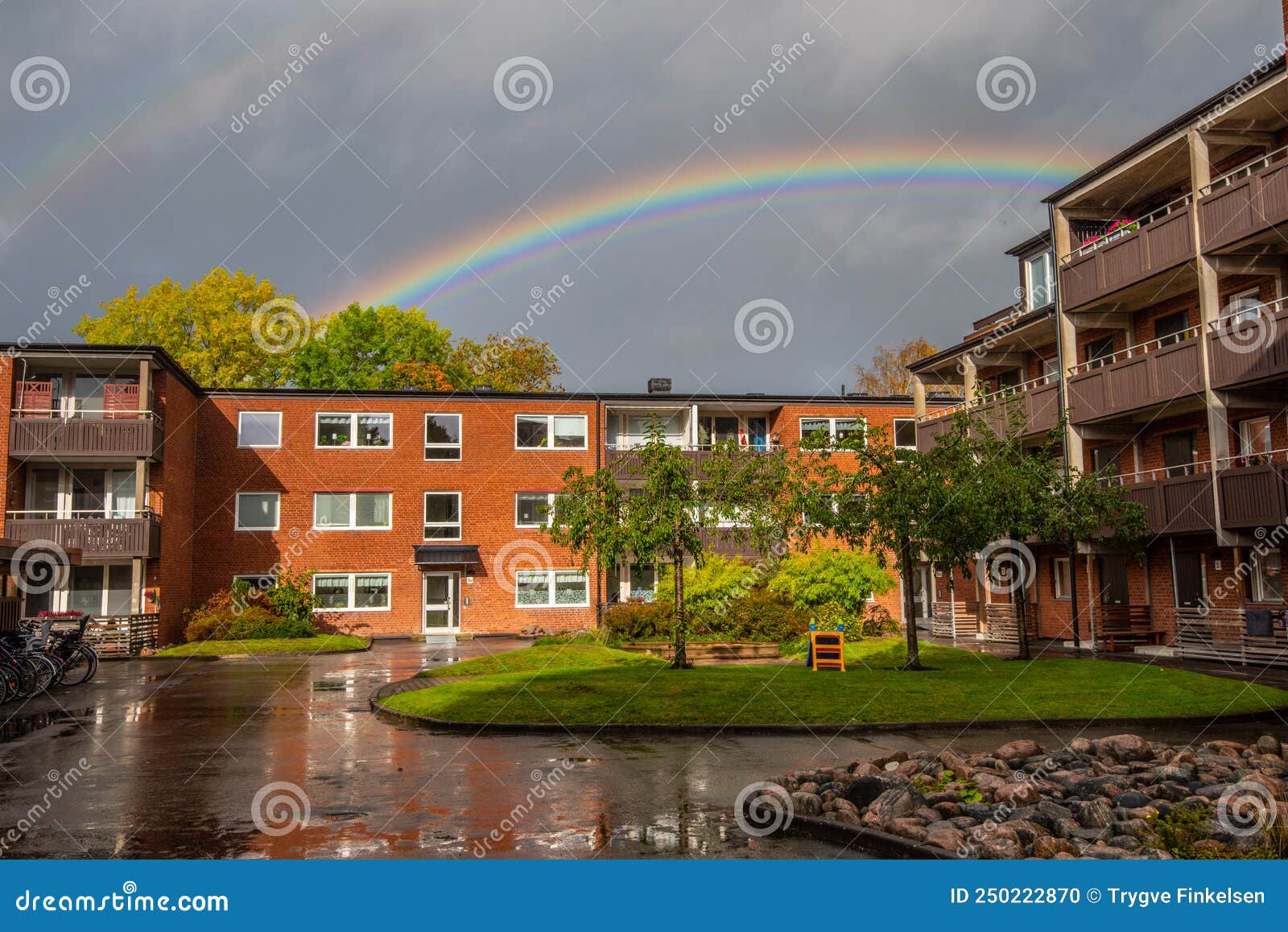 Rainbow Over a Brick Apartment Complex.. Stock Photo - Image of rainbow ...