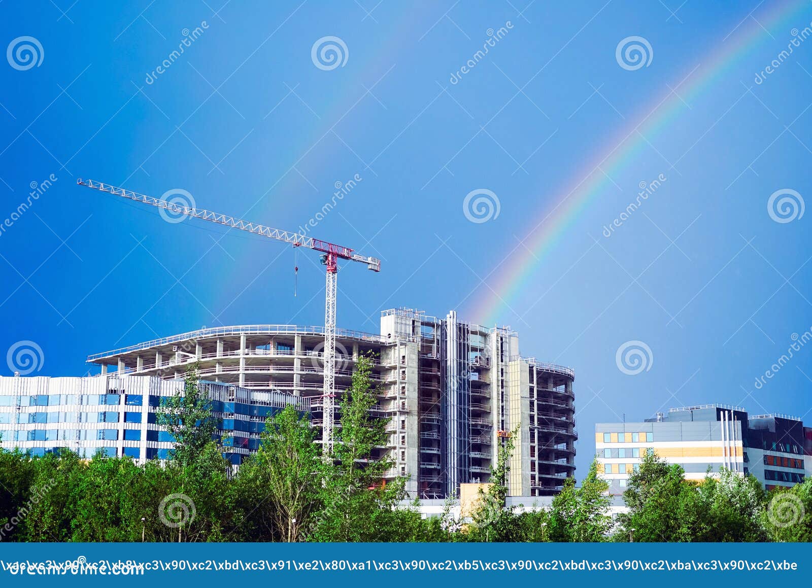 Rainbow Over the Building Under Construction and Construction Crane ...