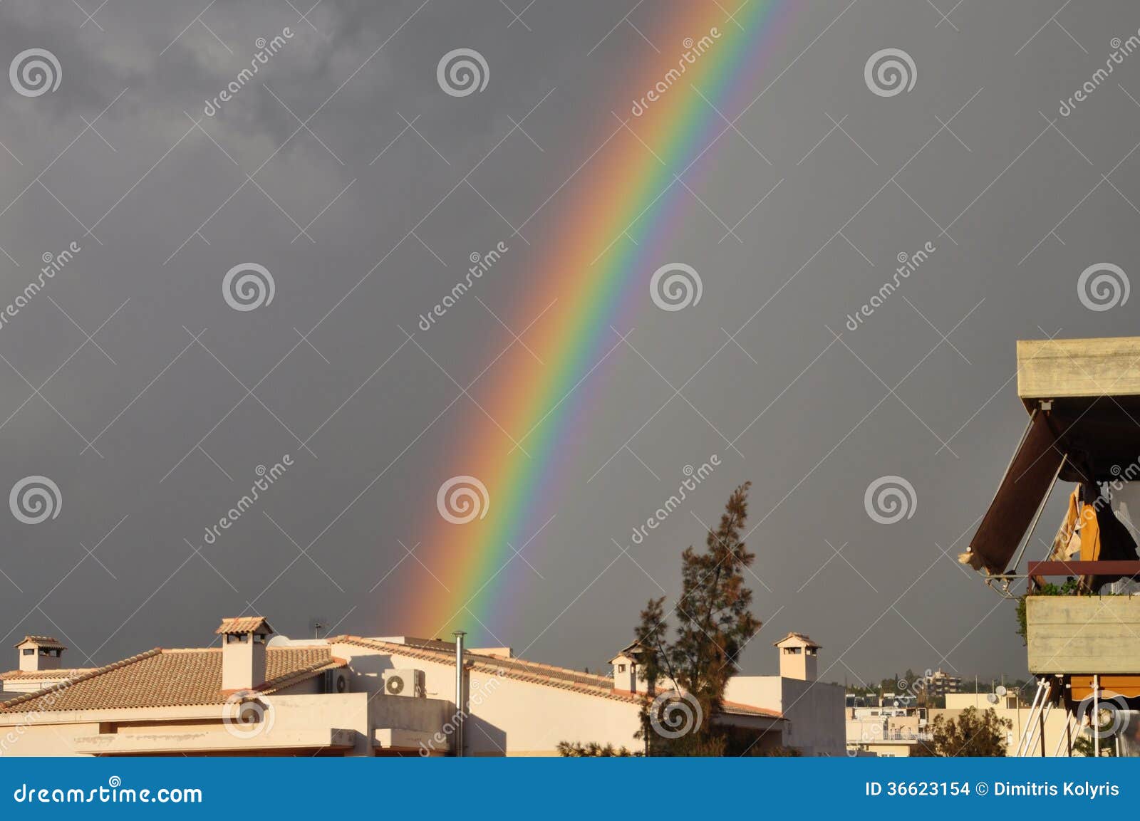 Rainbow over buildings stock photo. Image of reflection - 36623154