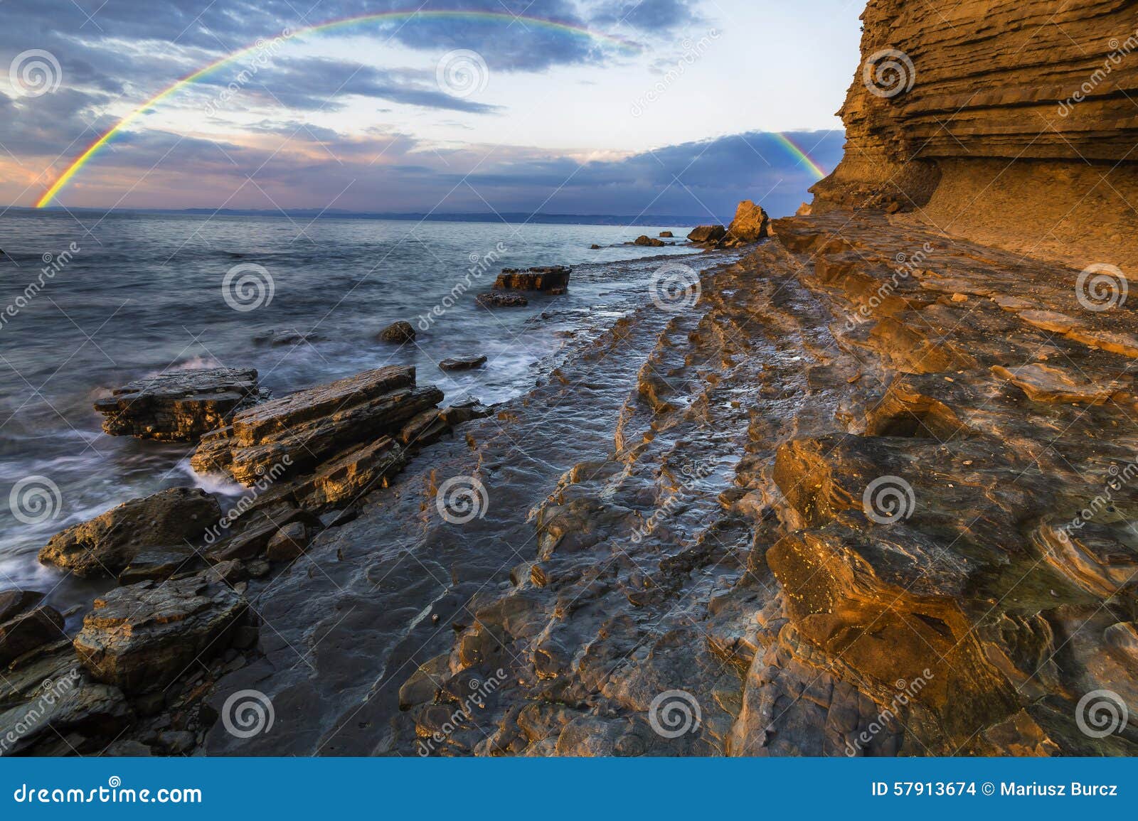 Rainbow Over the Cliff after Passing an Evening Storm Stock Photo ...