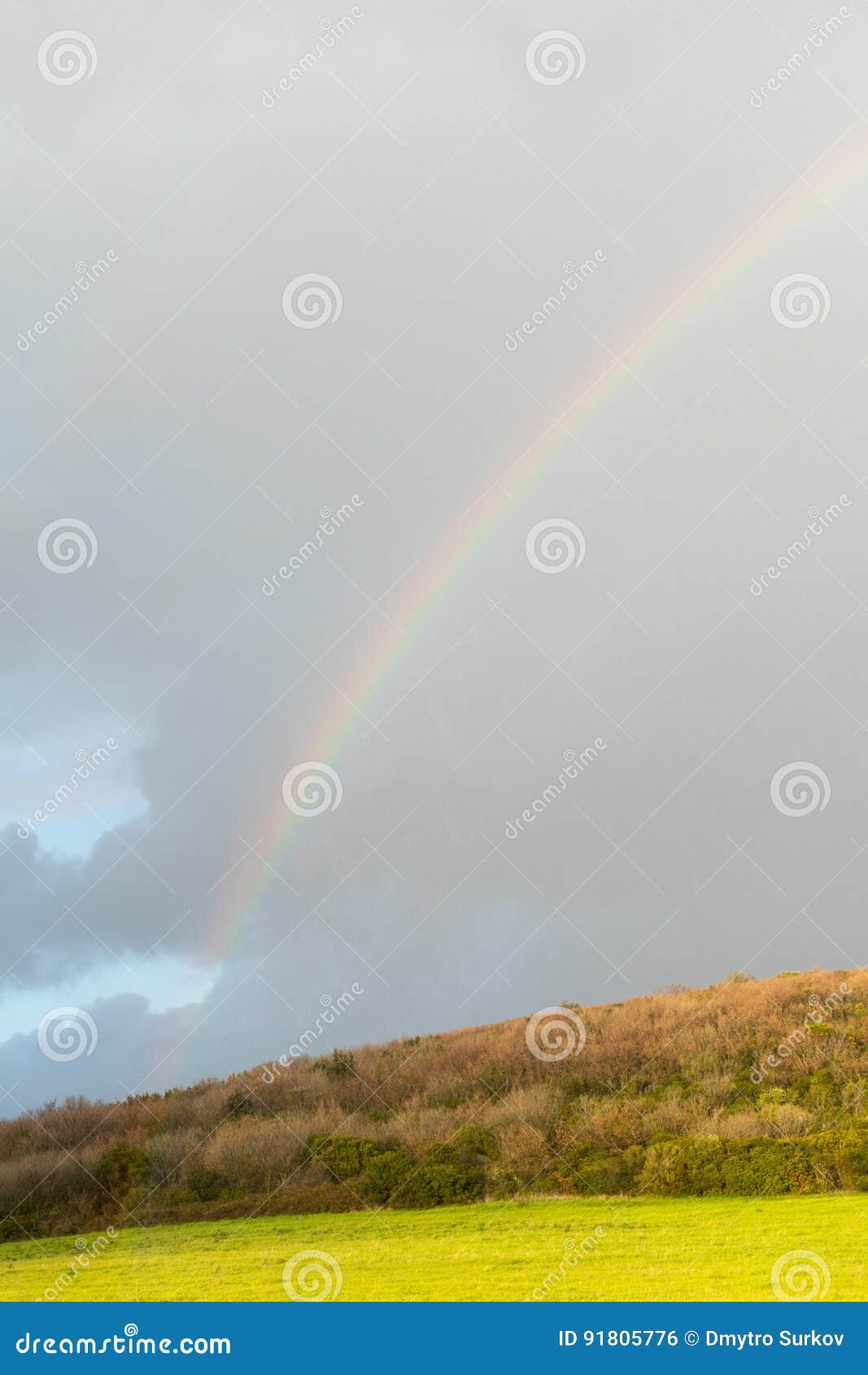 Rainbow over countryside stock photo. Image of thunderstorm - 91805776