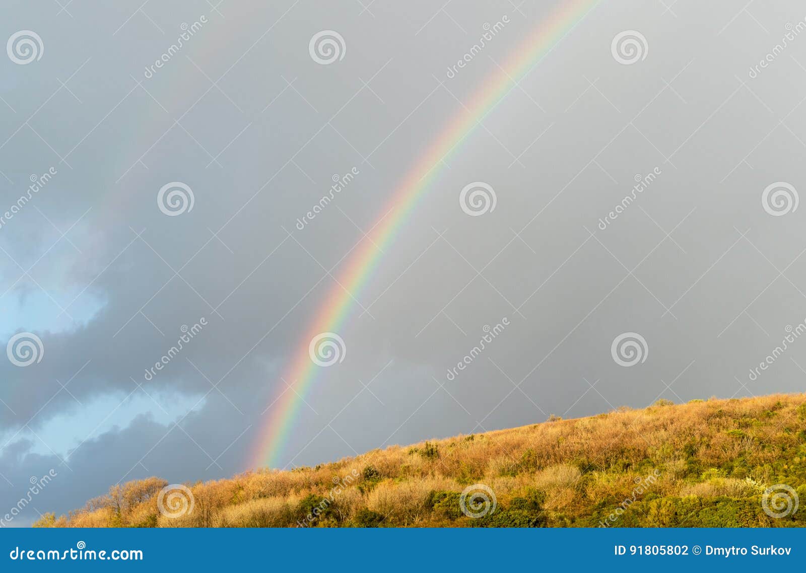 Rainbow over countryside stock photo. Image of outside - 91805802