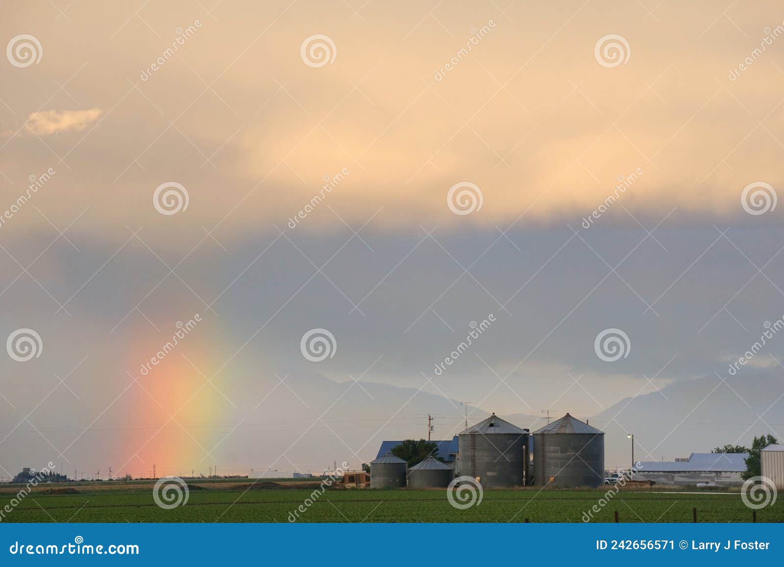 Rainbow over a farm stock image. Image of background - 242656571