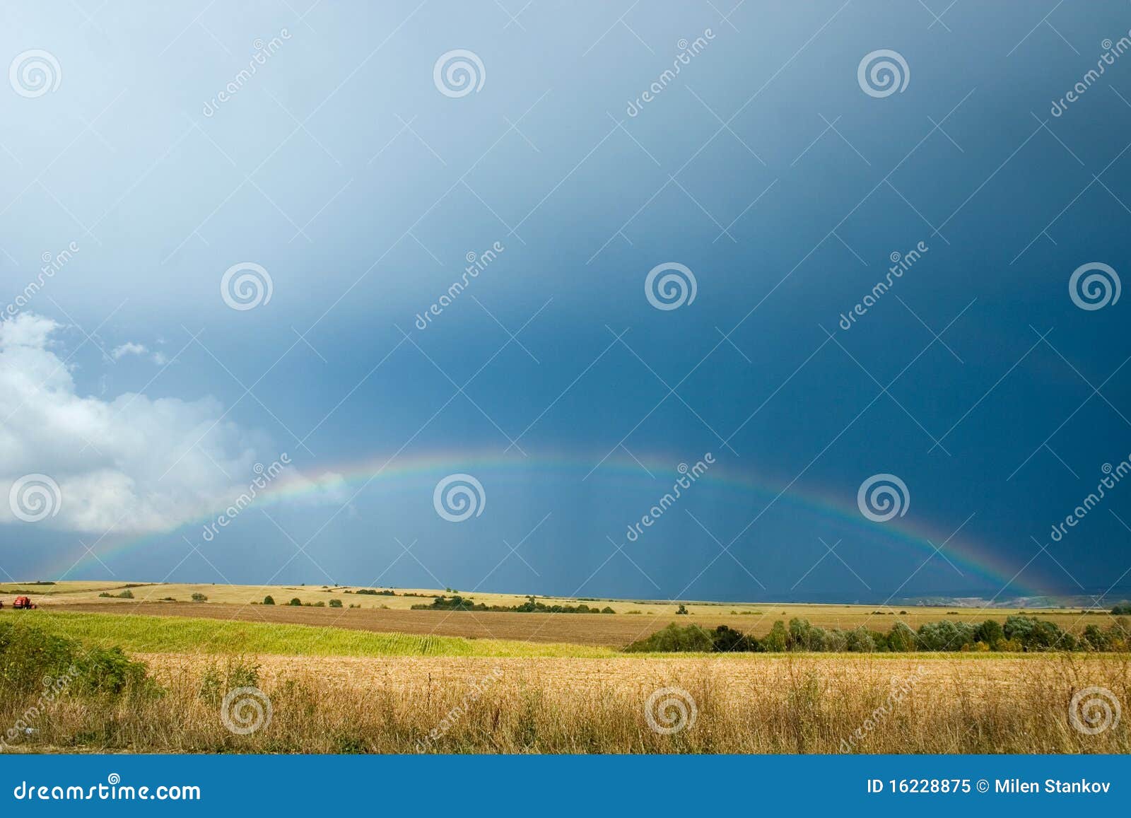 Rainbow over field stock image. Image of clouds, harvest - 16228875