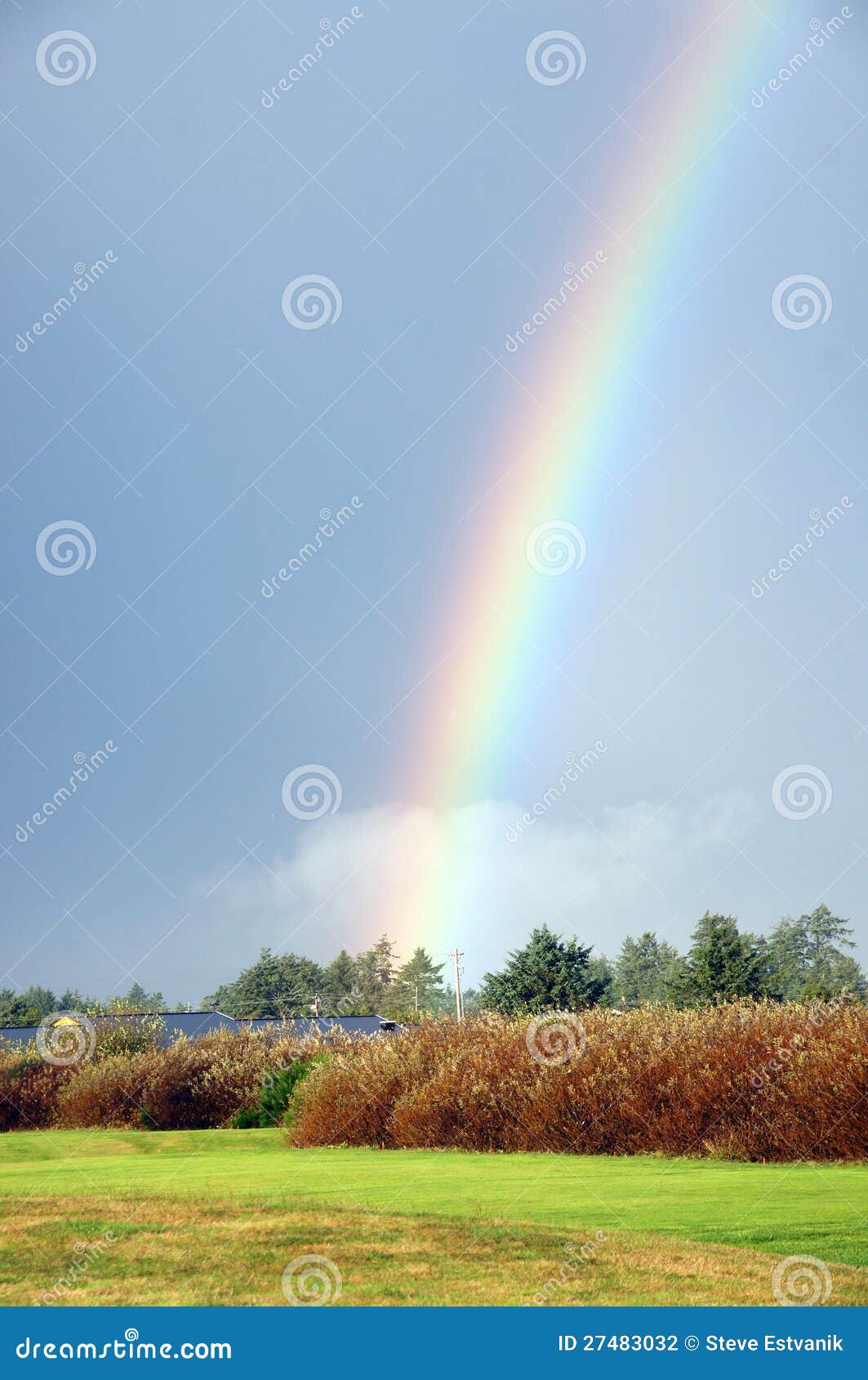 Rainbow over a field stock photo. Image of washington - 27483032