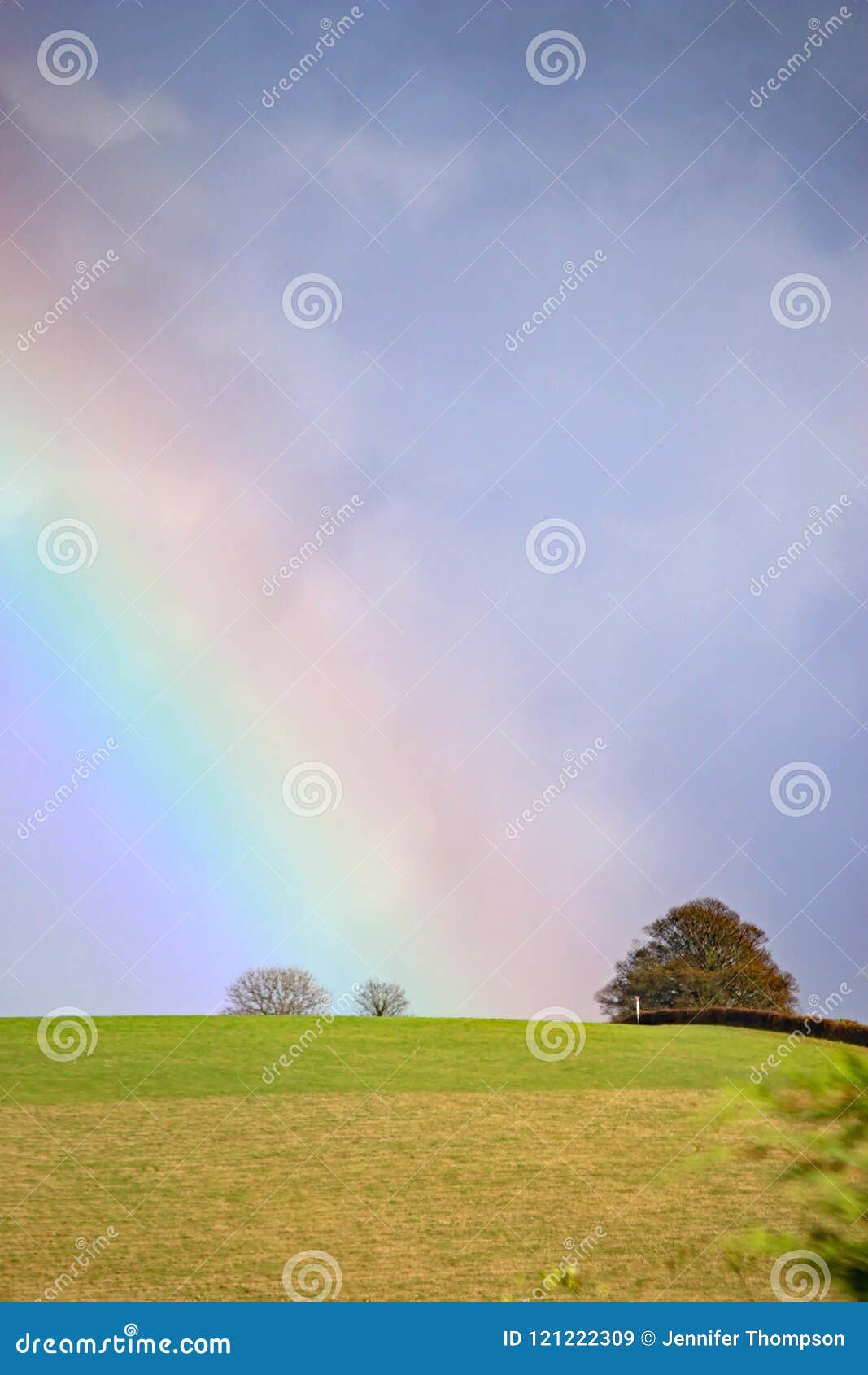 Rainbow over a field stock image. Image of cloud, field - 121222309