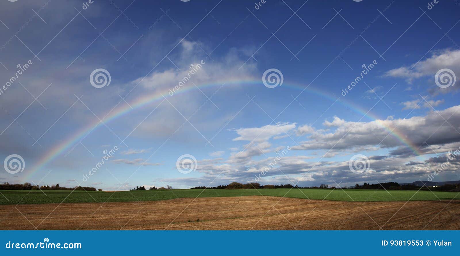 Rainbow over the field stock image. Image of rainbow - 93819553