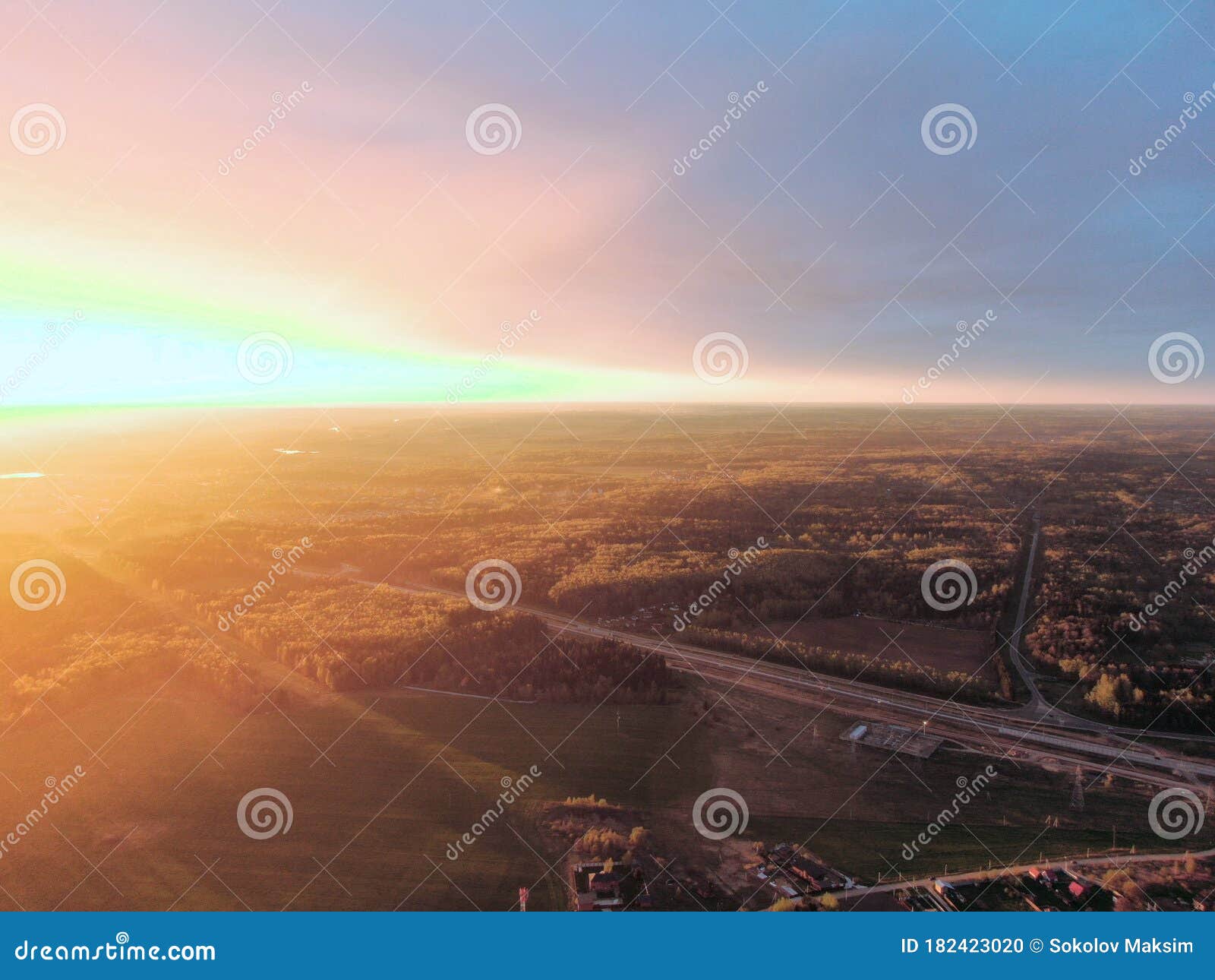 A Rainbow Over the Forest at Sunset from a High Altitude. Beautiful ...