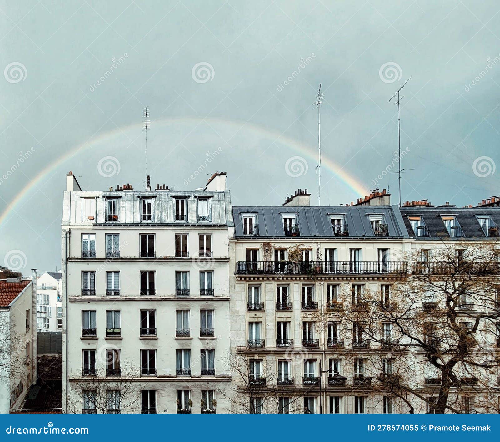 The Rainbow Over the Haussmanian Building in the City of Paris Stock ...