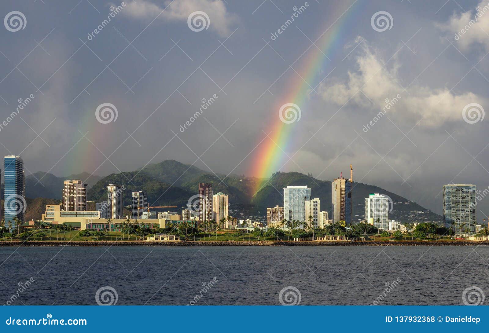 Rainbow over Honolulu stock photo. Image of landmark - 137932368