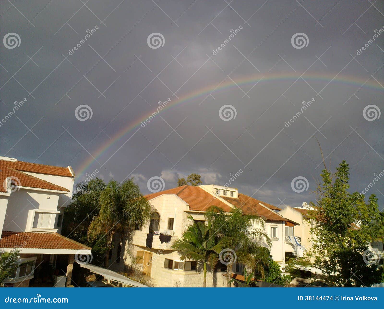 Rainbow over the houses stock photo. Image of village - 38144474