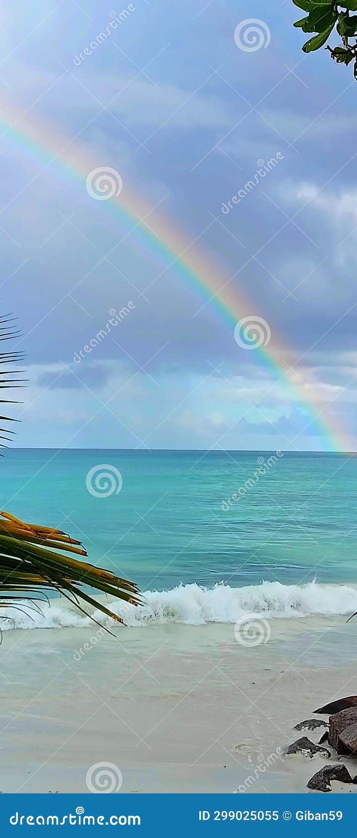 Rainbow over the Ocean stock image. Image of exotic - 299025055