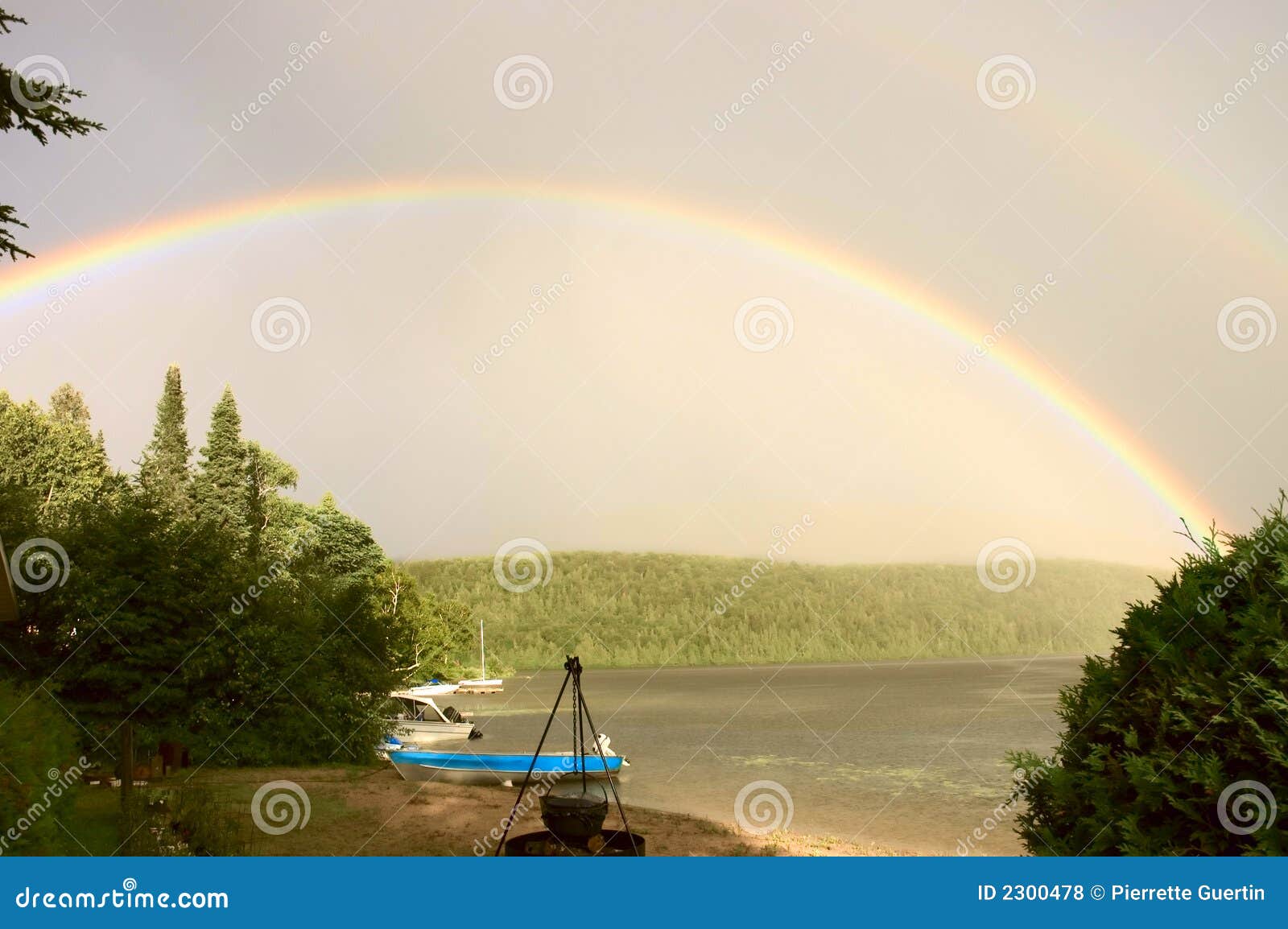Rainbow over a lake 2 stock photo. Image of sunset, landscape - 2300478