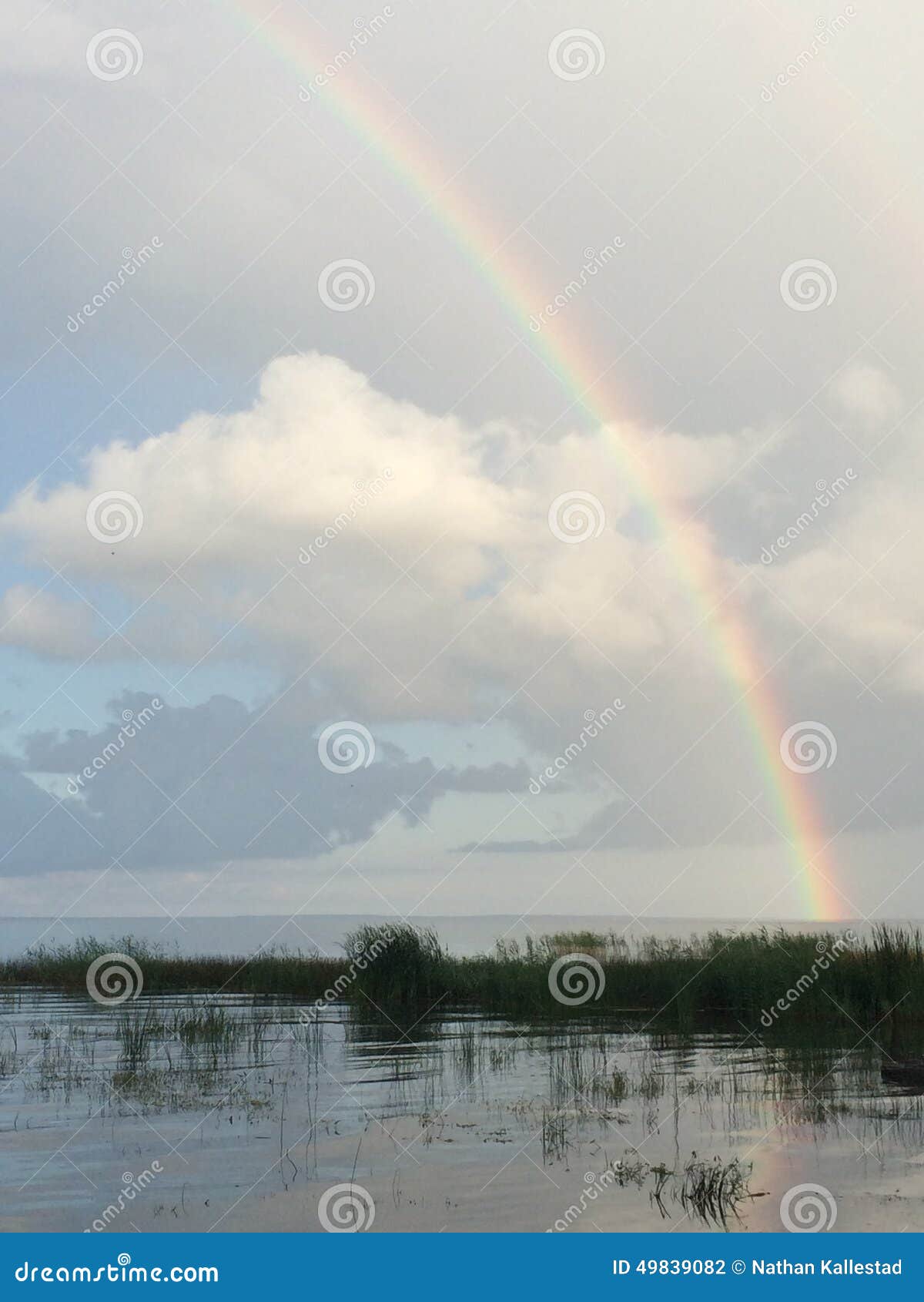 Rainbow Over Lake with Clouds Stock Photo - Image of lake, clouds: 49839082