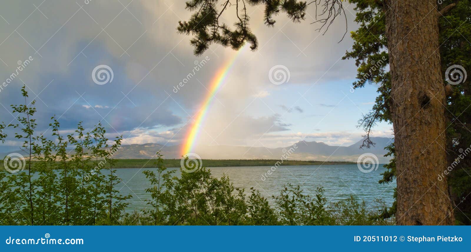 Rainbow Over Lake Laberge, Yukon T, Canada Stock Photo - Image of ...