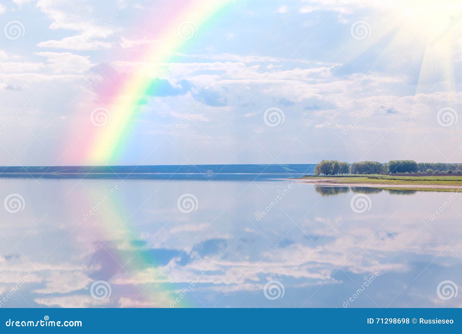 Rainbow over the lake stock photo. Image of light, rain - 71298698
