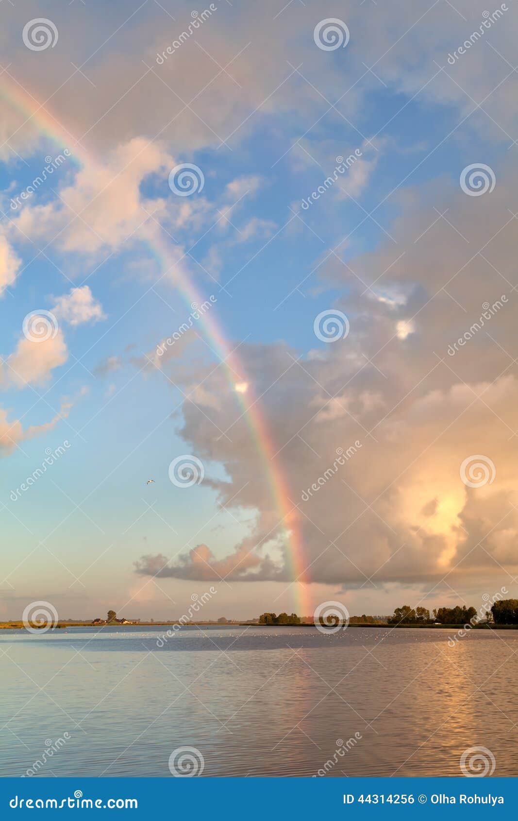 Rainbow Over Lake at Sunset Stock Photo - Image of beauty, reflection ...
