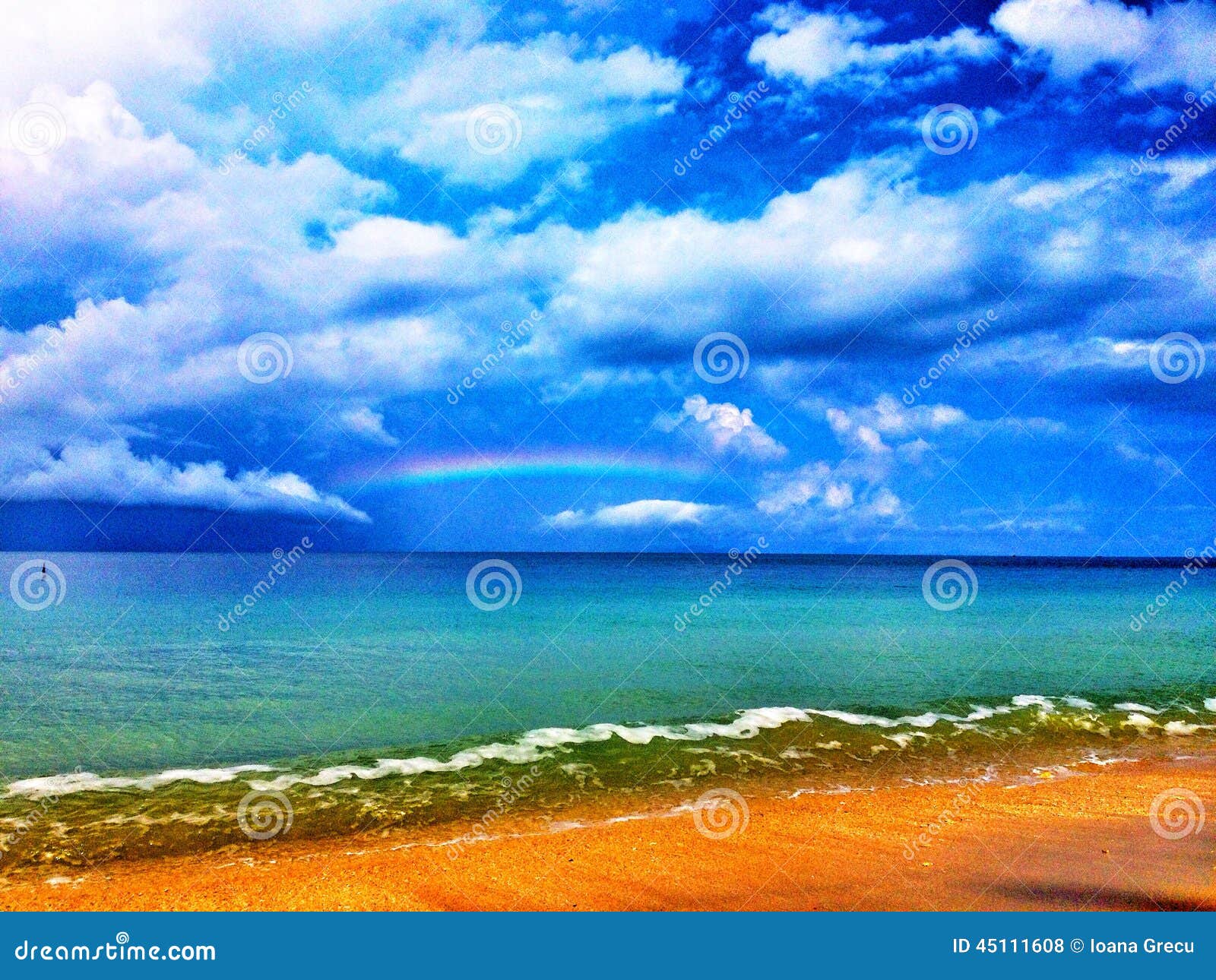 Rainbow over the ocean stock photo. Image of blue, clouds - 45111608