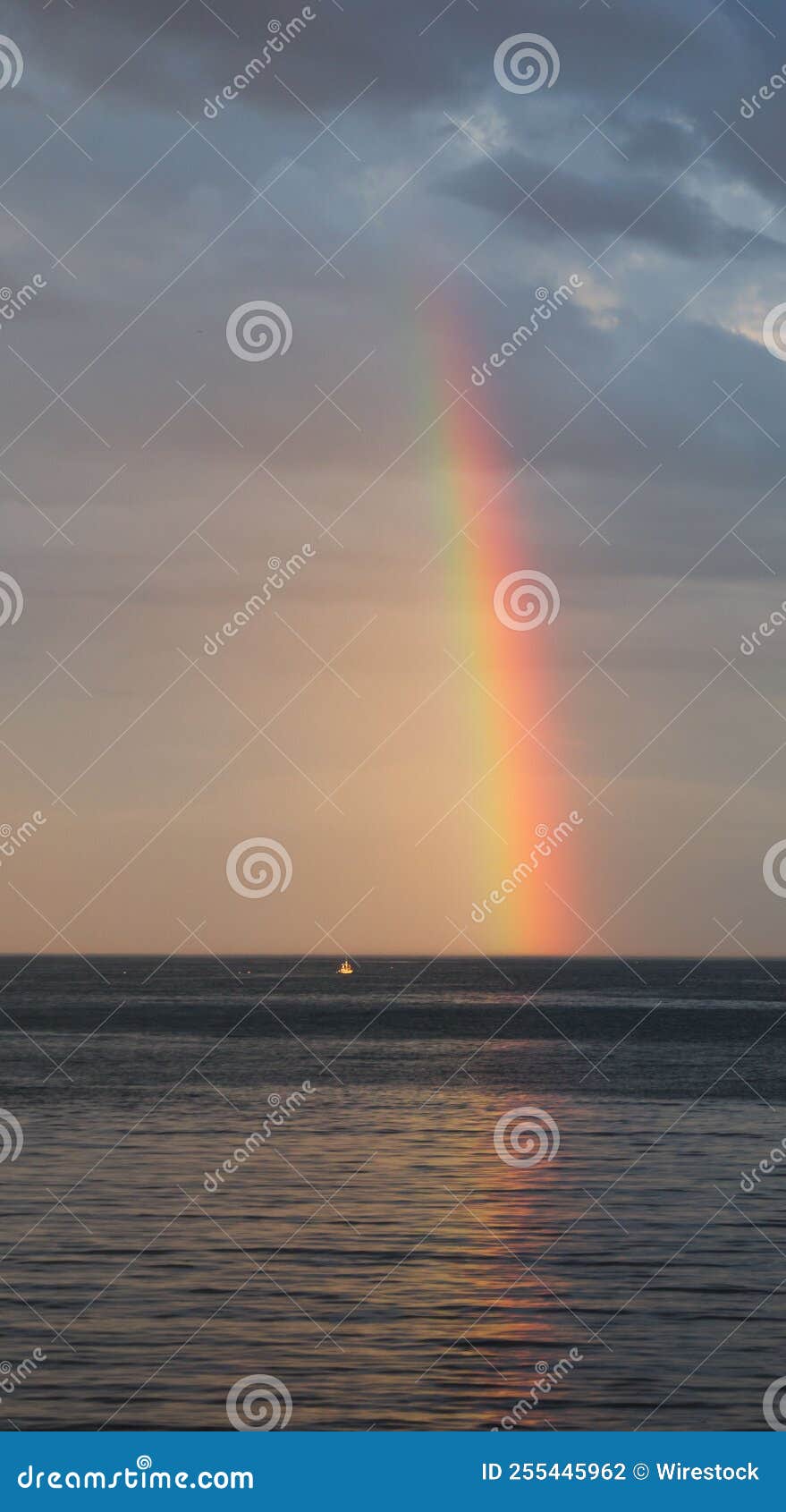 Rainbow Over Ocean at Sunset Stock Photo - Image of stormy, sunset ...