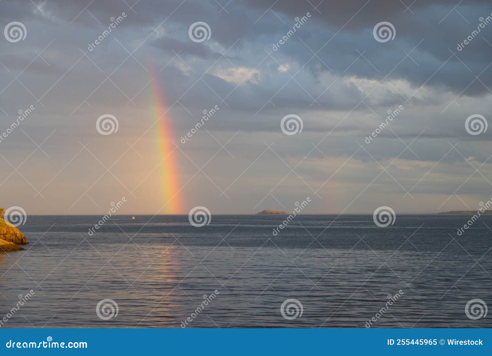 Rainbow Over Ocean at Sunset Stock Image - Image of coast, island ...