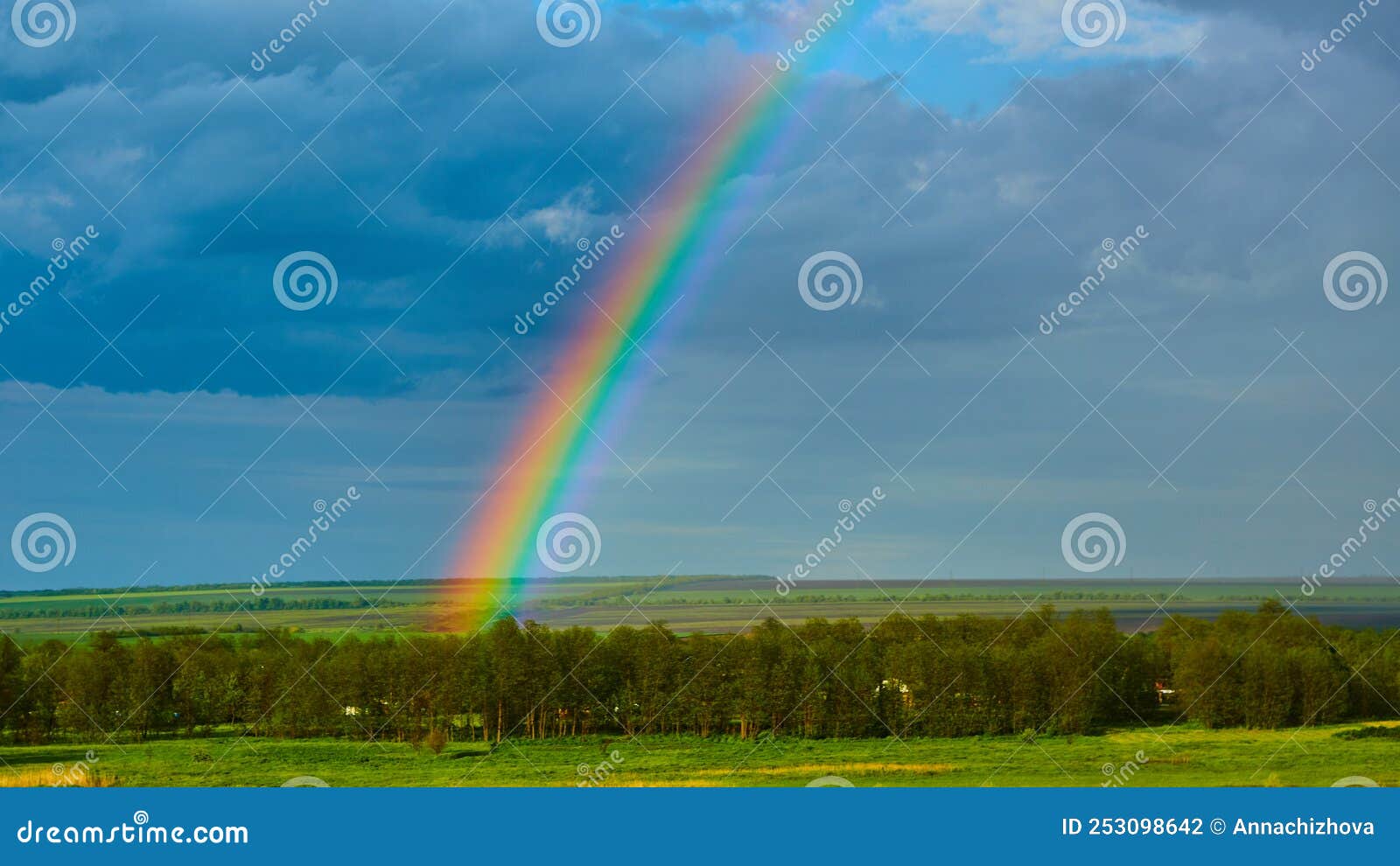 The Rainbow Over Rural Landscape after Thunderstorm. Stock Photo ...