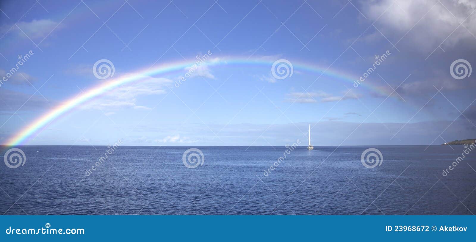 Rainbow over sea stock photo. Image of rainbow, wide - 23968672