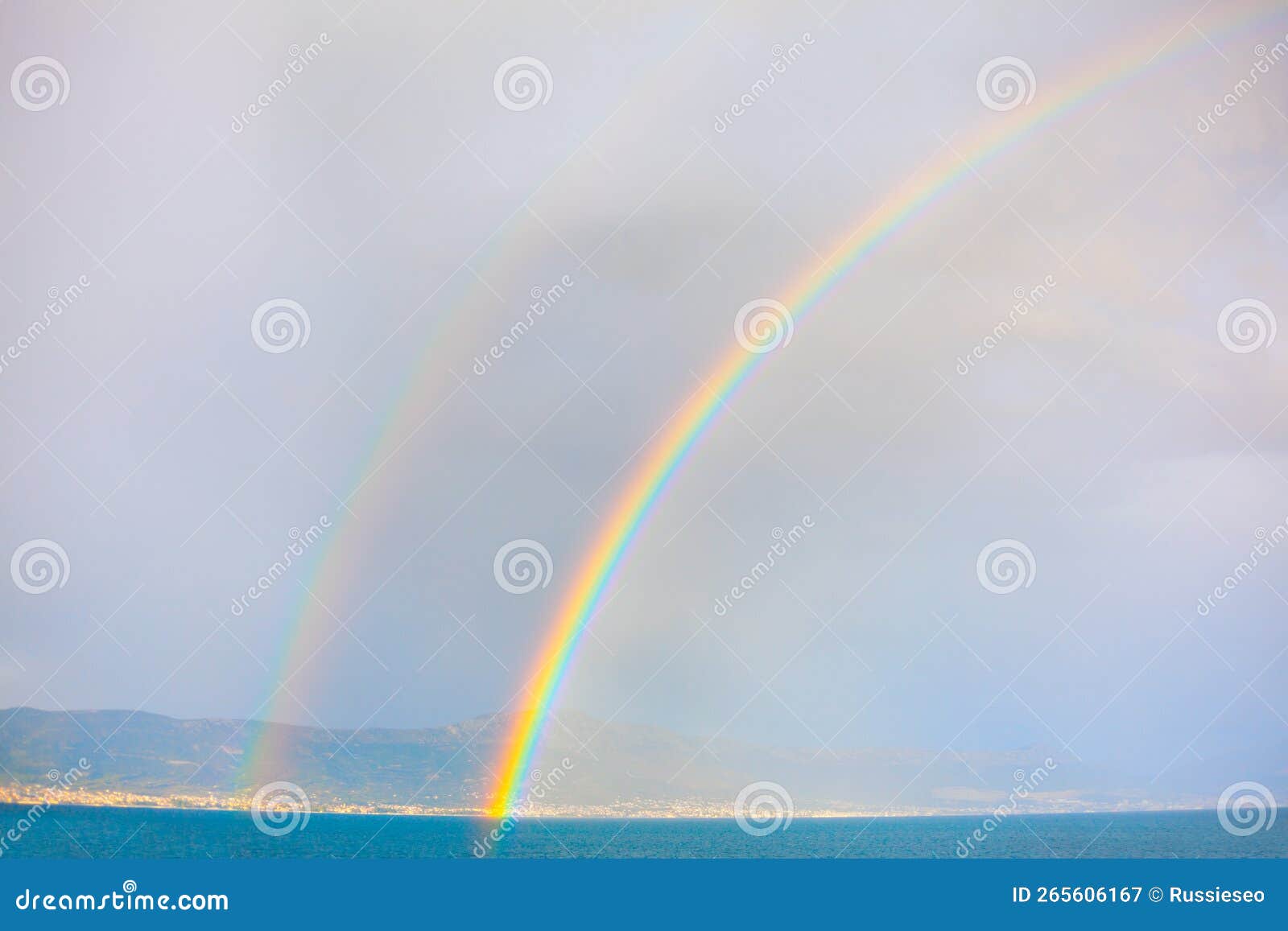 Rainbow Over the Sea and Mountains Stock Image - Image of horizon, rain ...