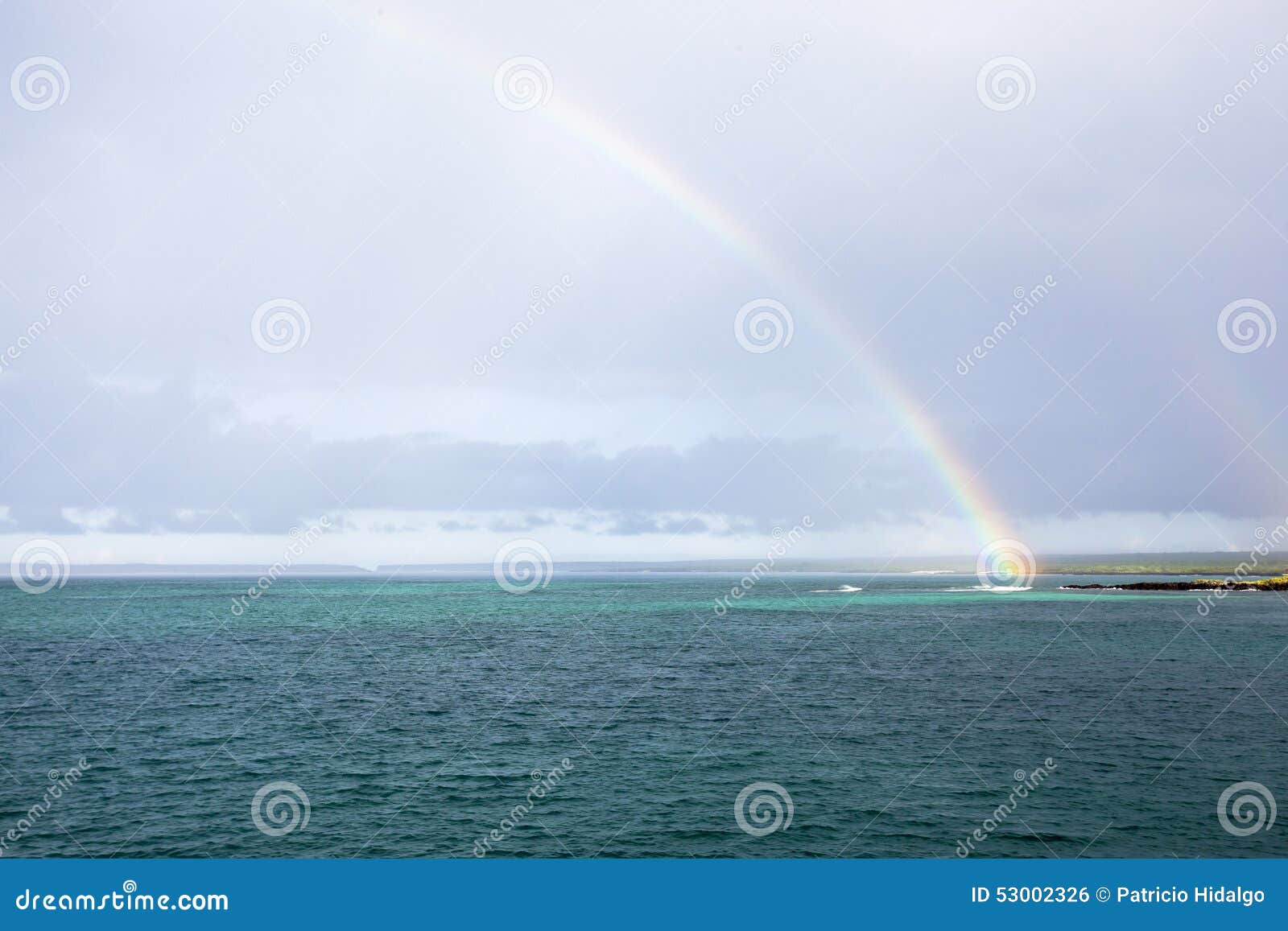 Rainbow over the sea stock photo. Image of rainbow, green - 53002326