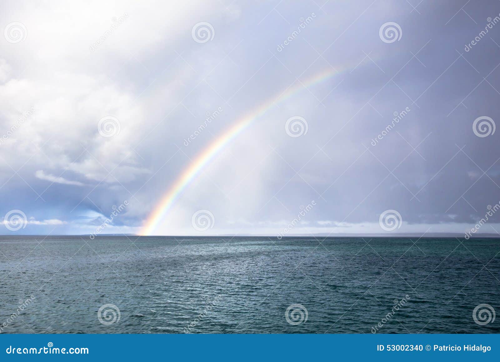 Rainbow over the sea stock photo. Image of tropical, water - 53002340