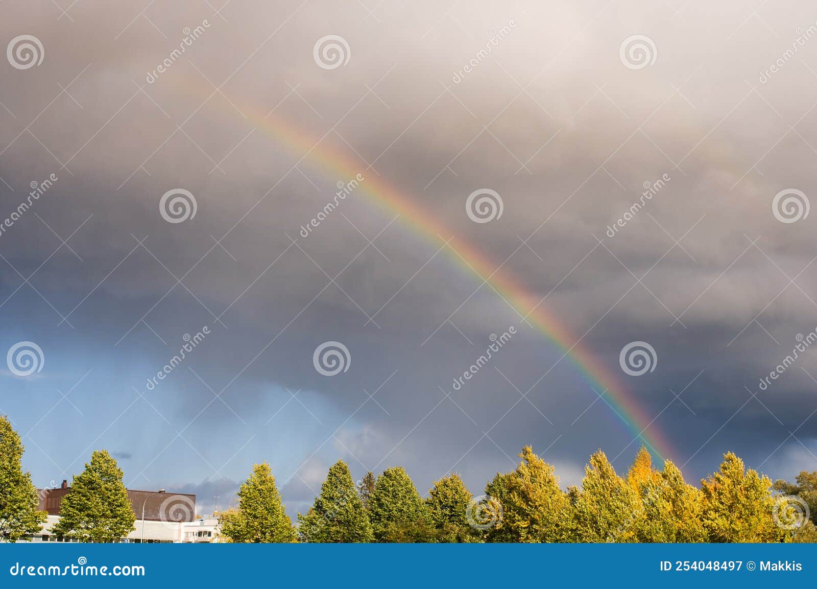 Rainbow Over the Tree Tops, Dramatic Sky and Clouds Stock Image - Image ...