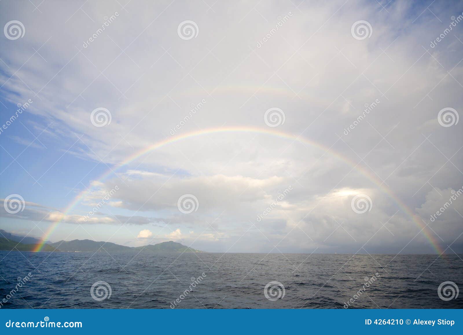 Rainbow over water stock photo. Image of exotic, seychelles - 4264210