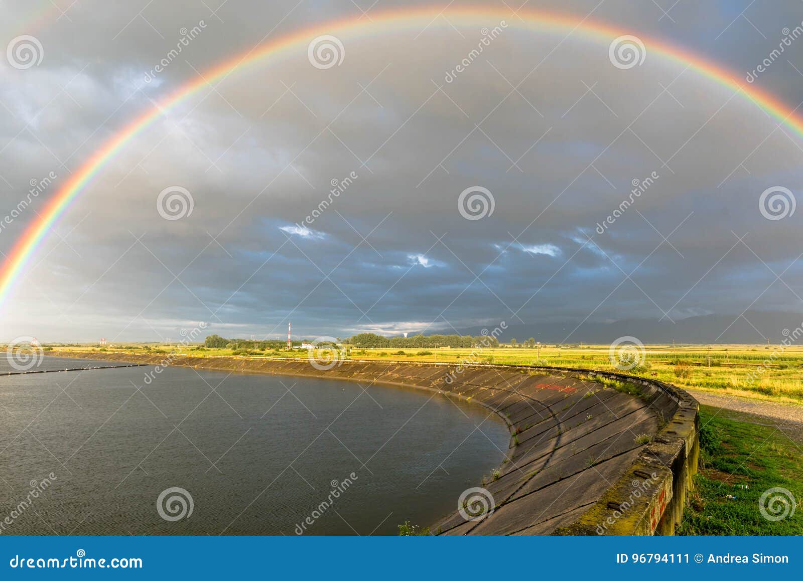Rainbow over water stock image. Image of rain, landscape - 96794111