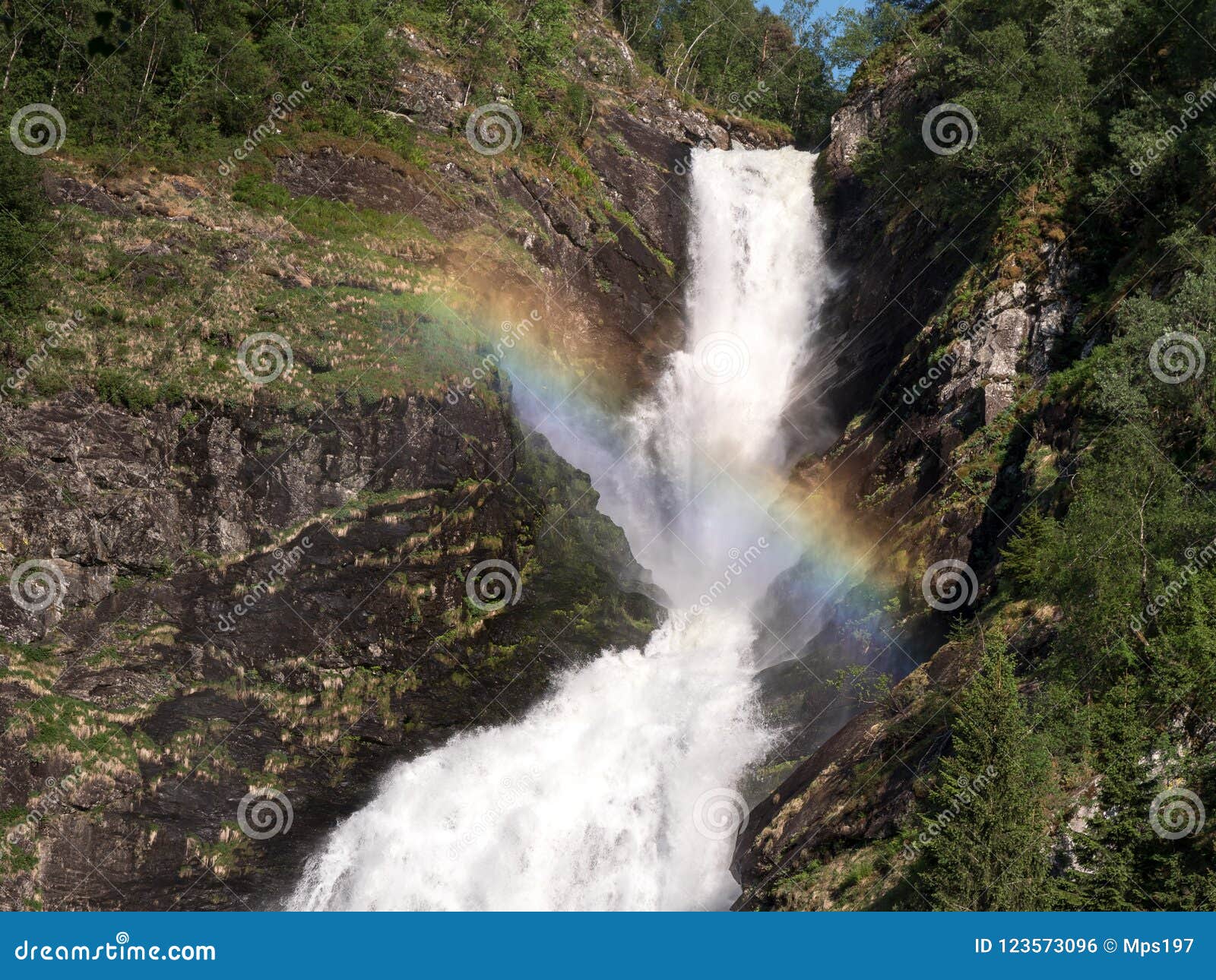 Rainbow over waterfall stock photo. Image of flowing - 123573096