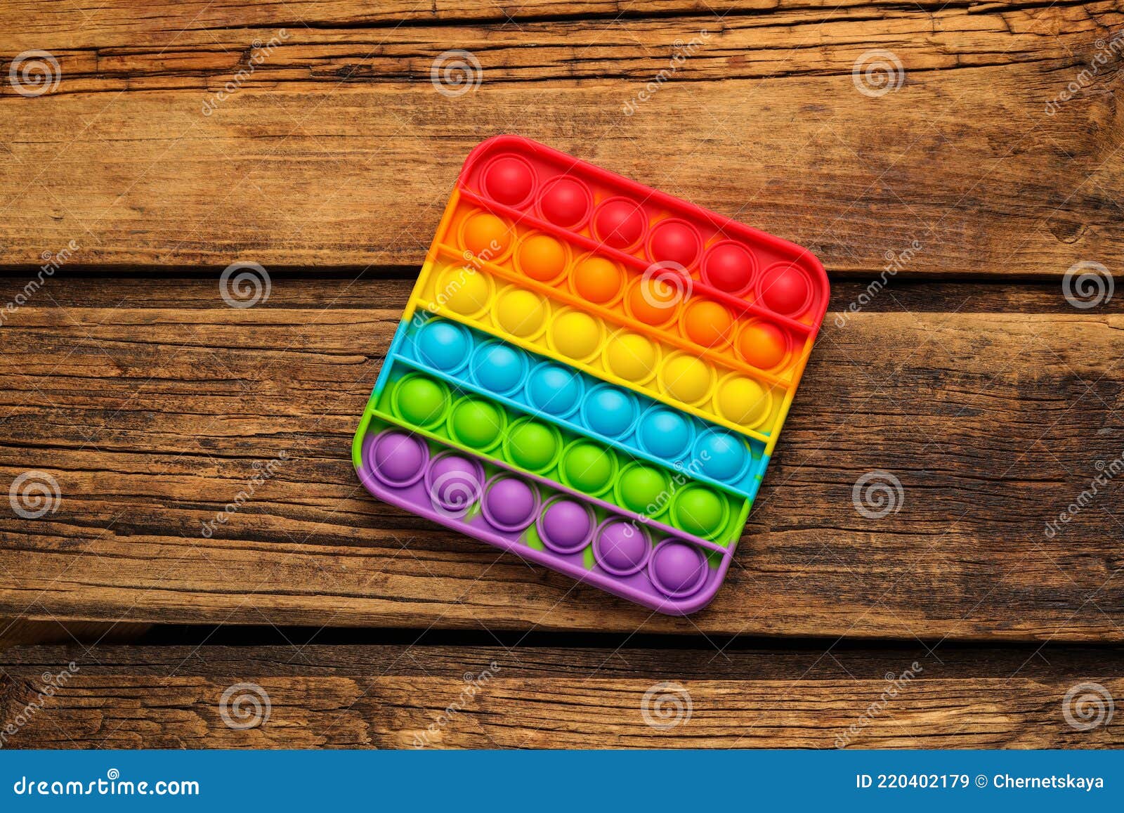 Rainbow Pop it Fidget Toy on Wooden Table, Top View Stock Image - Image ...