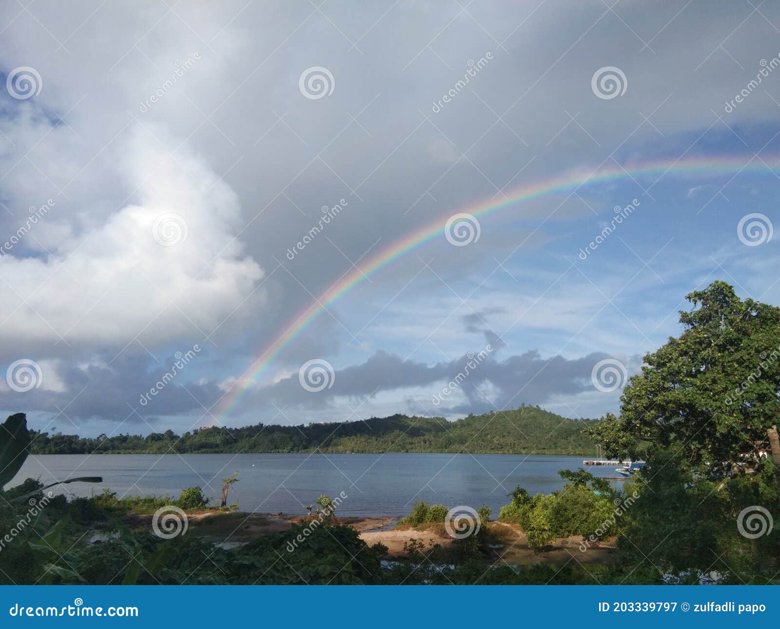 Rainbow after rain stock image. Image of reflection - 203339797