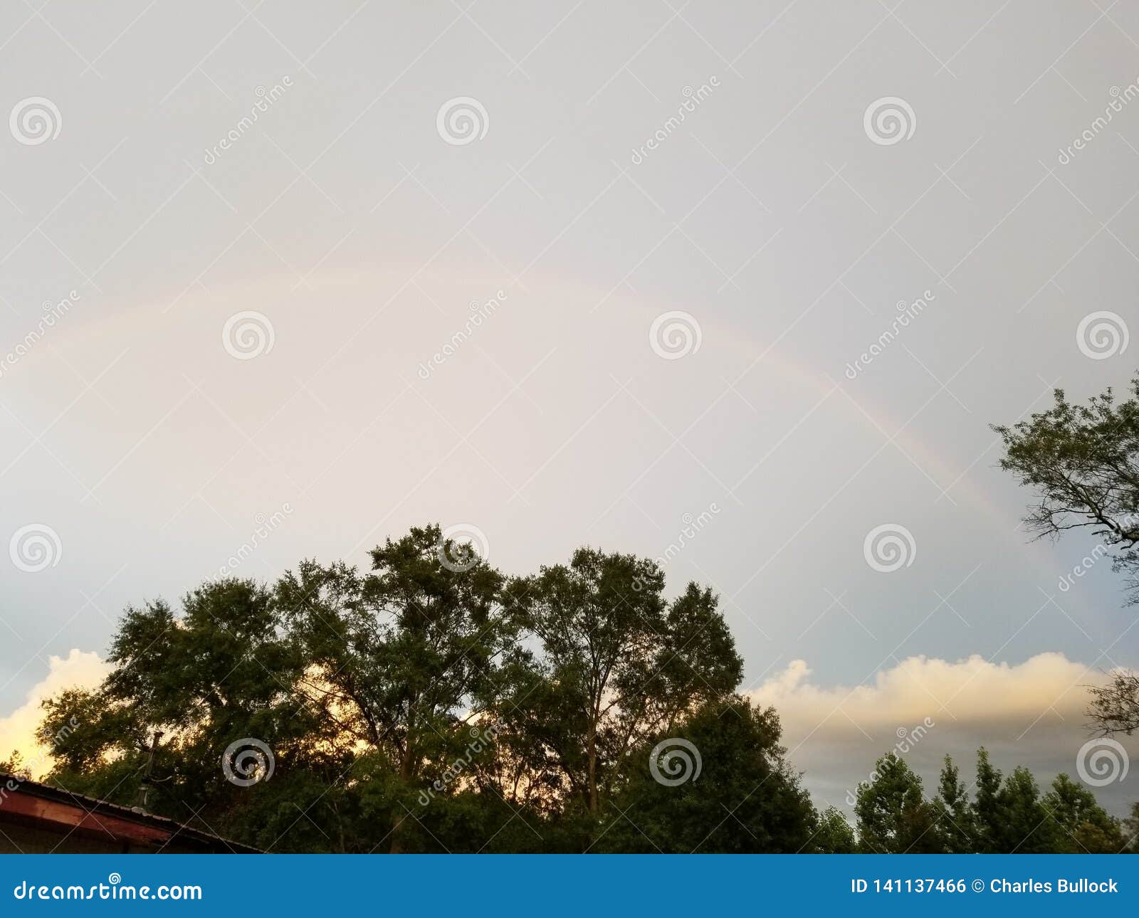 Rainbow after a rain storm stock photo. Image of spring - 141137466