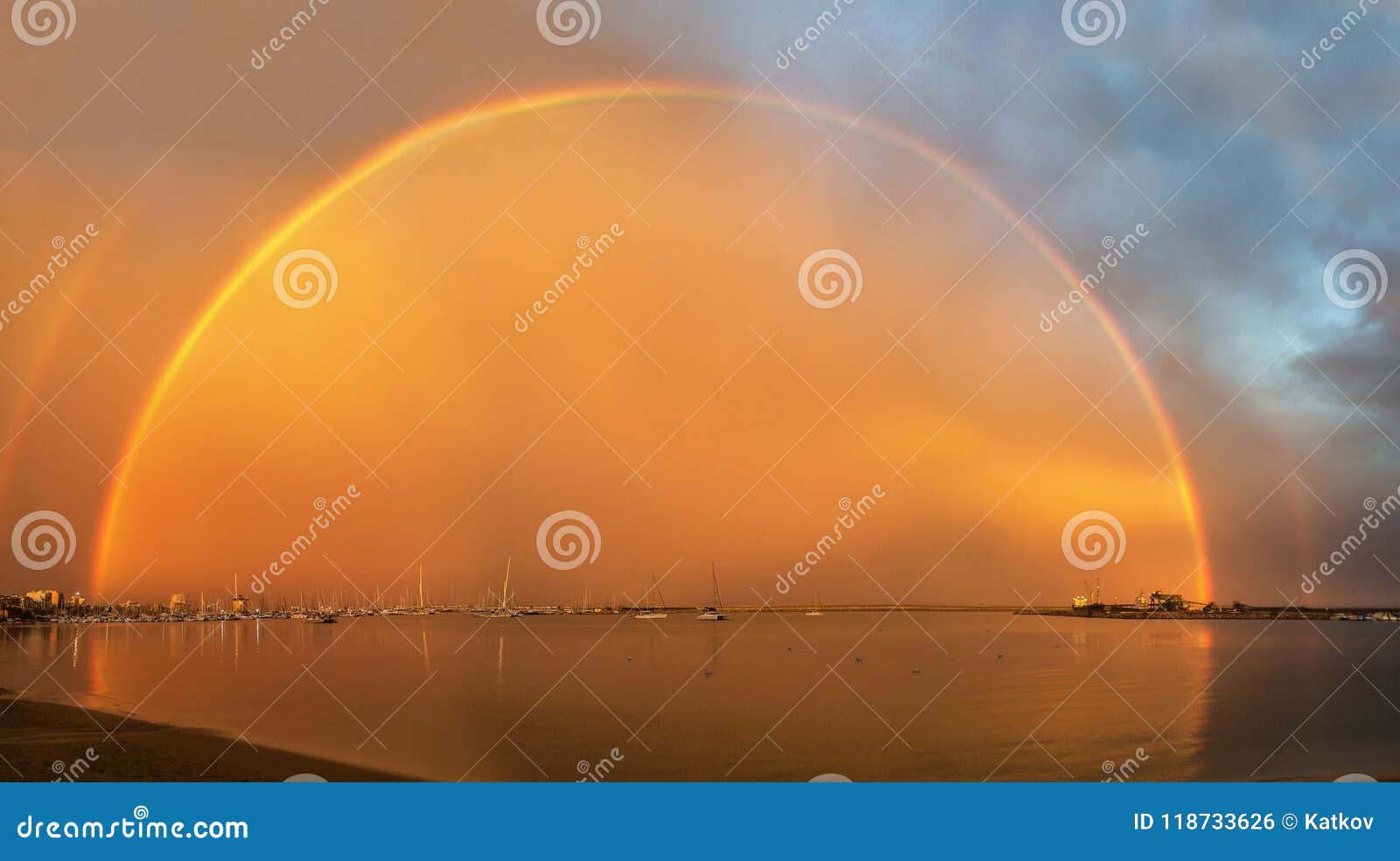 Rainbow at red sunset sea stock photo. Image of beautiful - 118733626