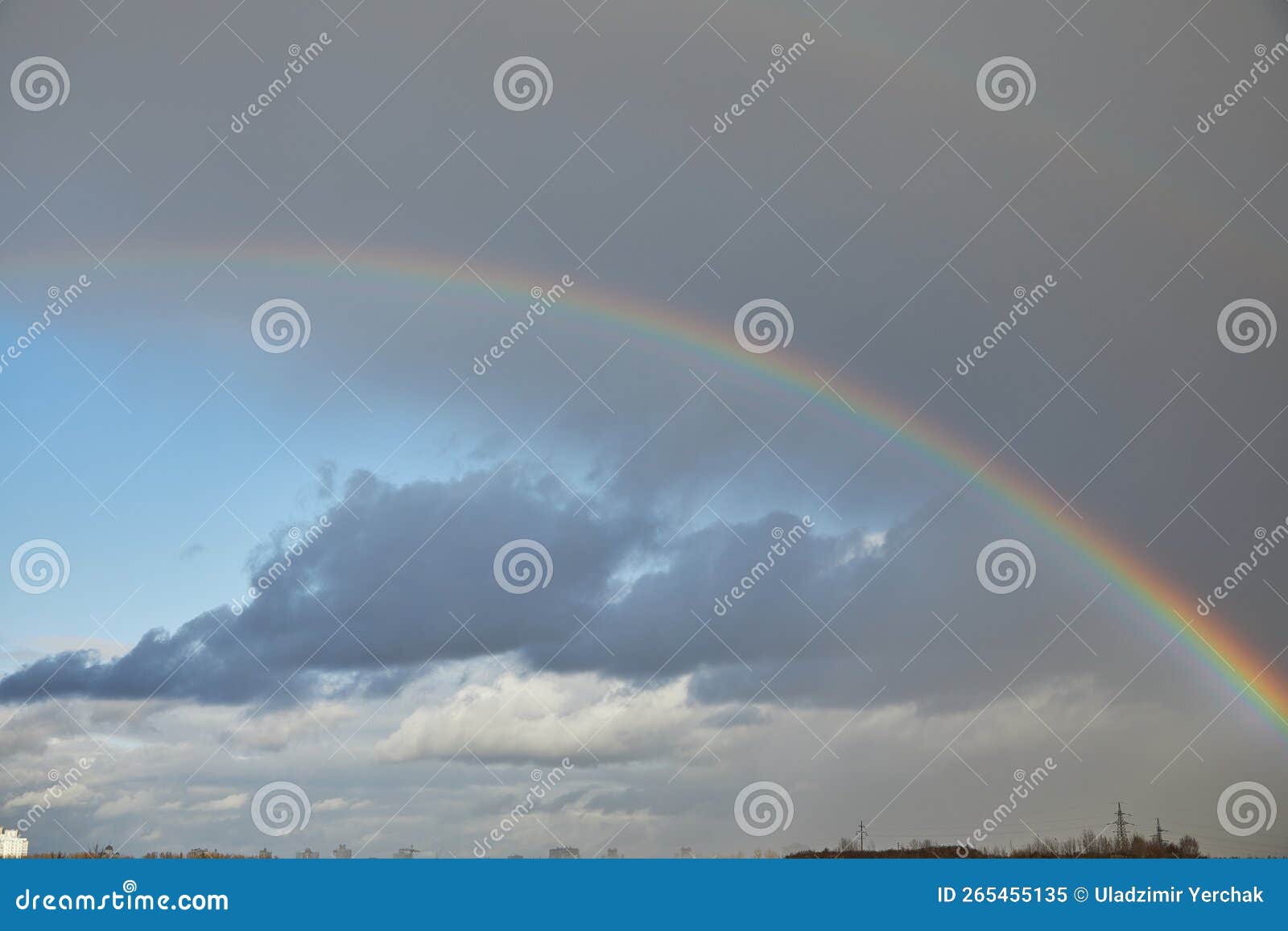 Rainbow in the Sky after the Rain. Blue Sky. White Clouds. the Sky is ...