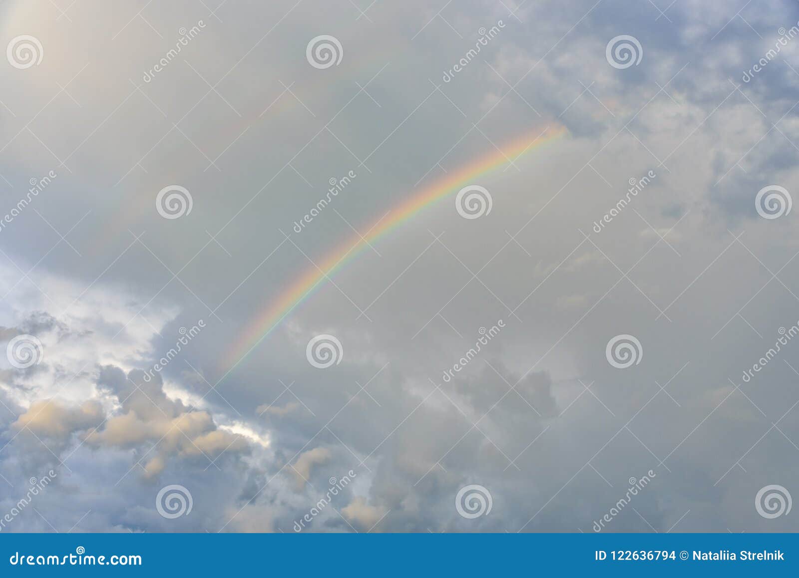 Rainbow. the Sky after the Rain. Field and the Sky after the Rain. a ...